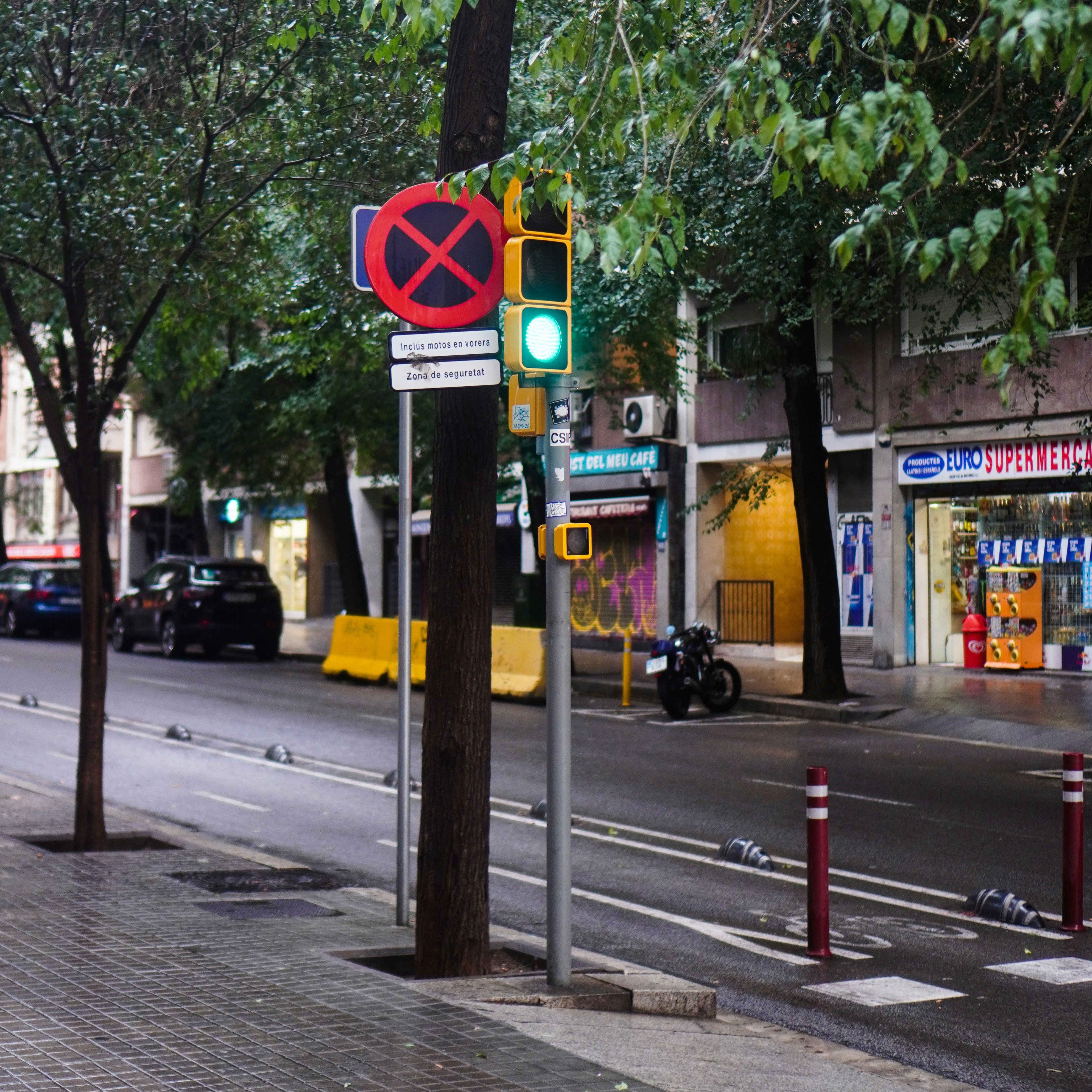 a street sign on the sidewalk