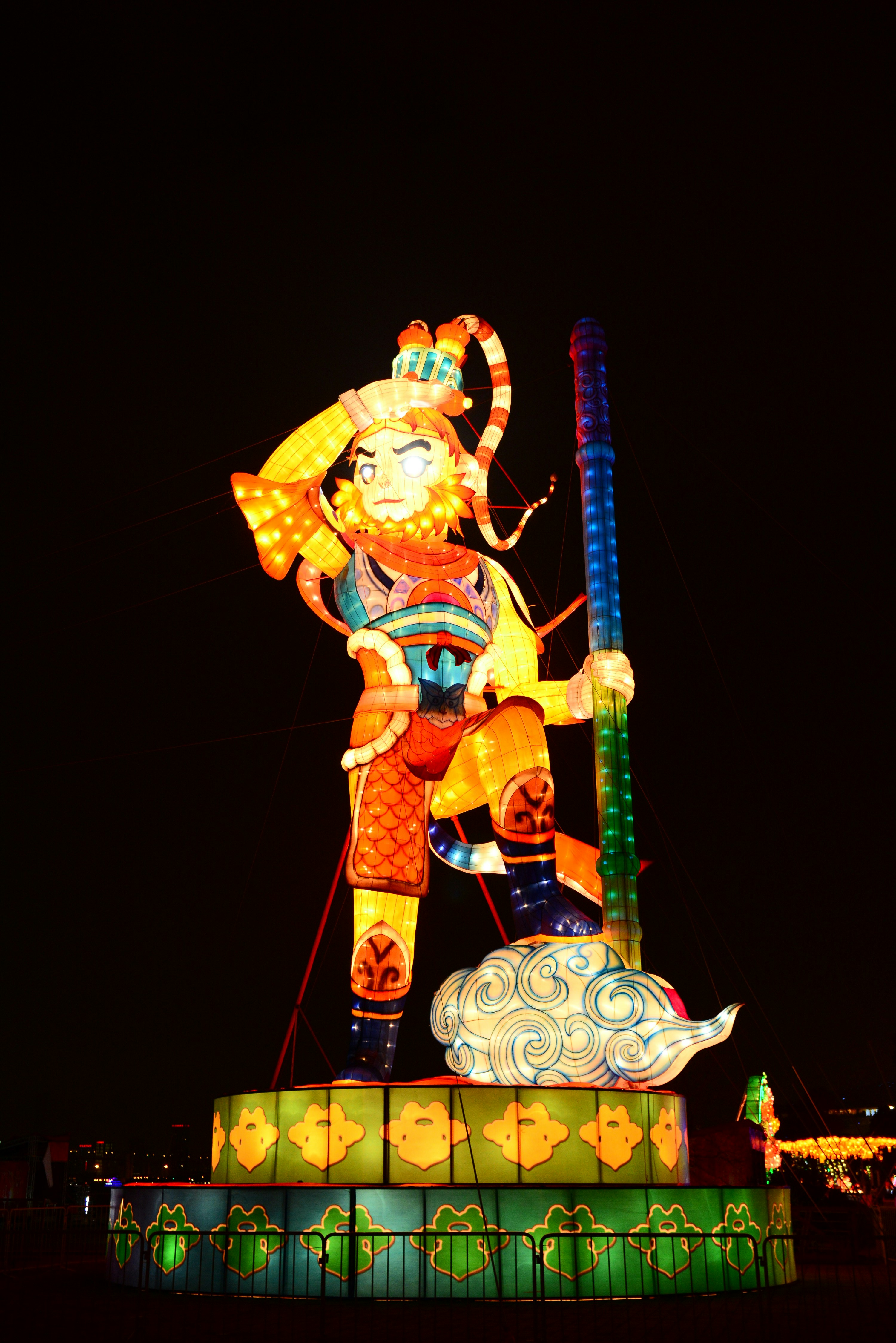 Neon Warrior: Lantern-Glow Guardian Rising Over a Cloud Pedestal