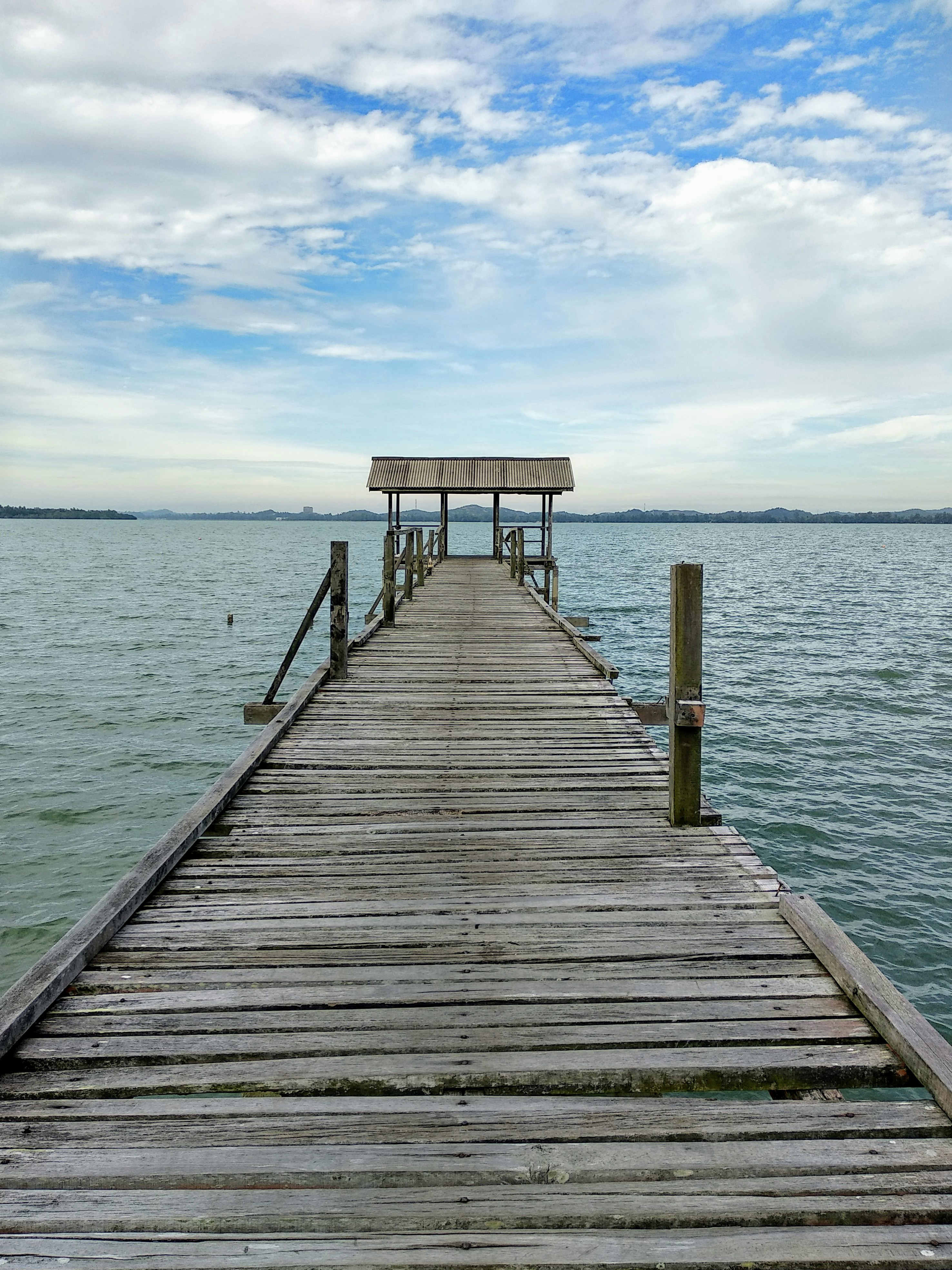 A wooden dock over water photo – Free Water Image on Unsplash