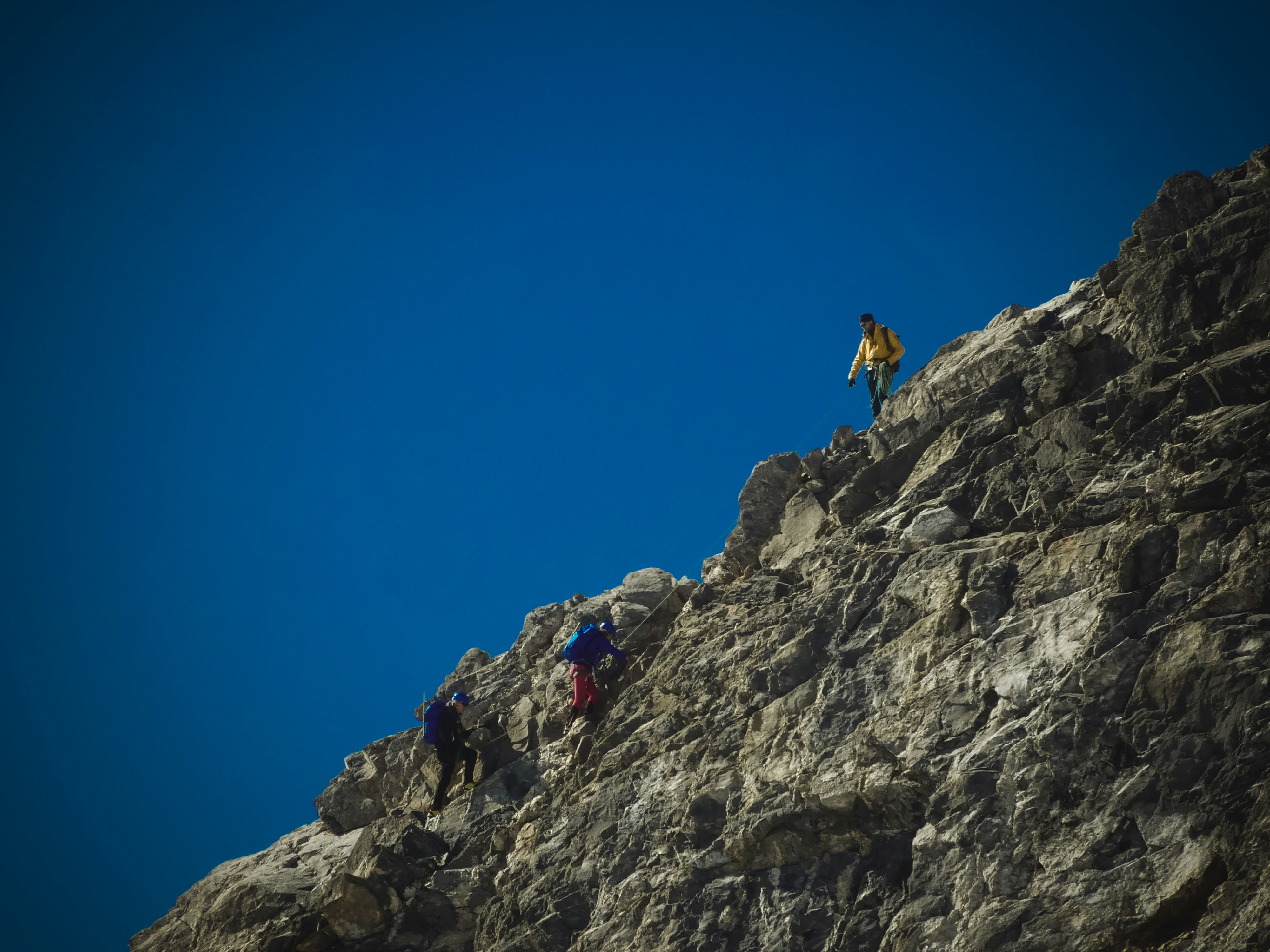 A group of people climbing a mountain photo – Free Tignes Image on Unsplash