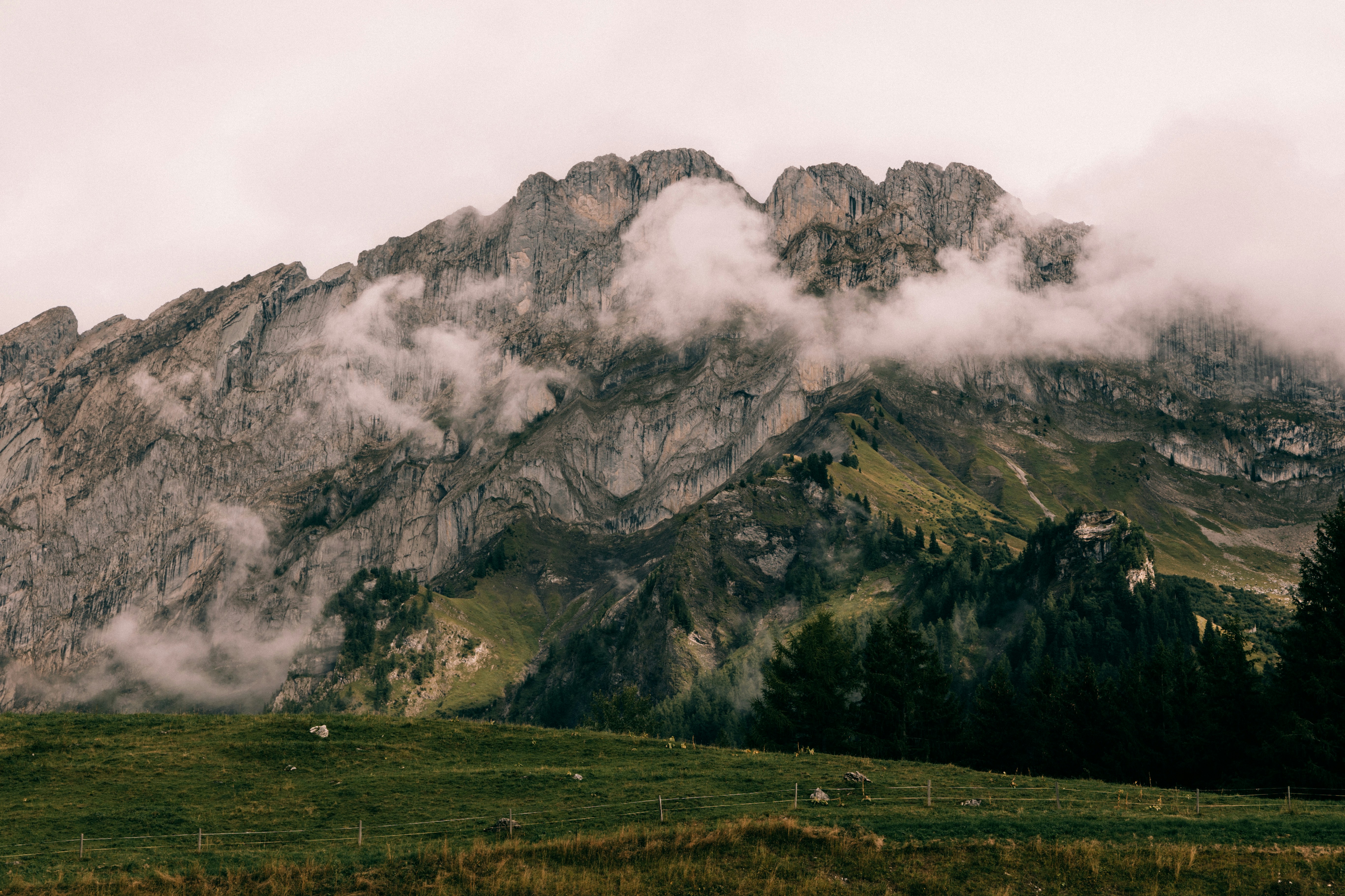 A mountain with smoke coming out of it photo – Free Switzerland Image on Unsplash