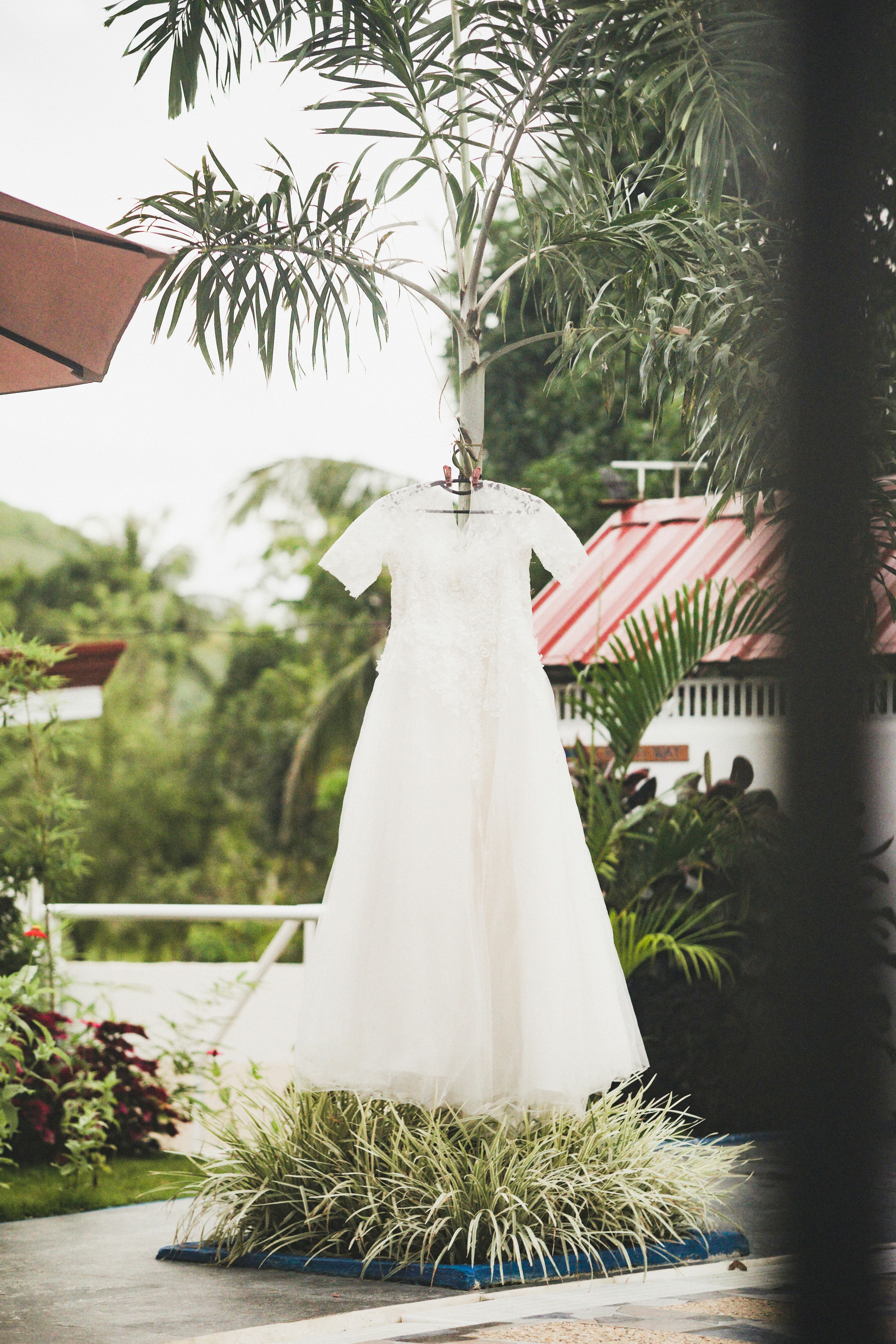 A beautiful bridesmaid gown | a water fountain in a garden