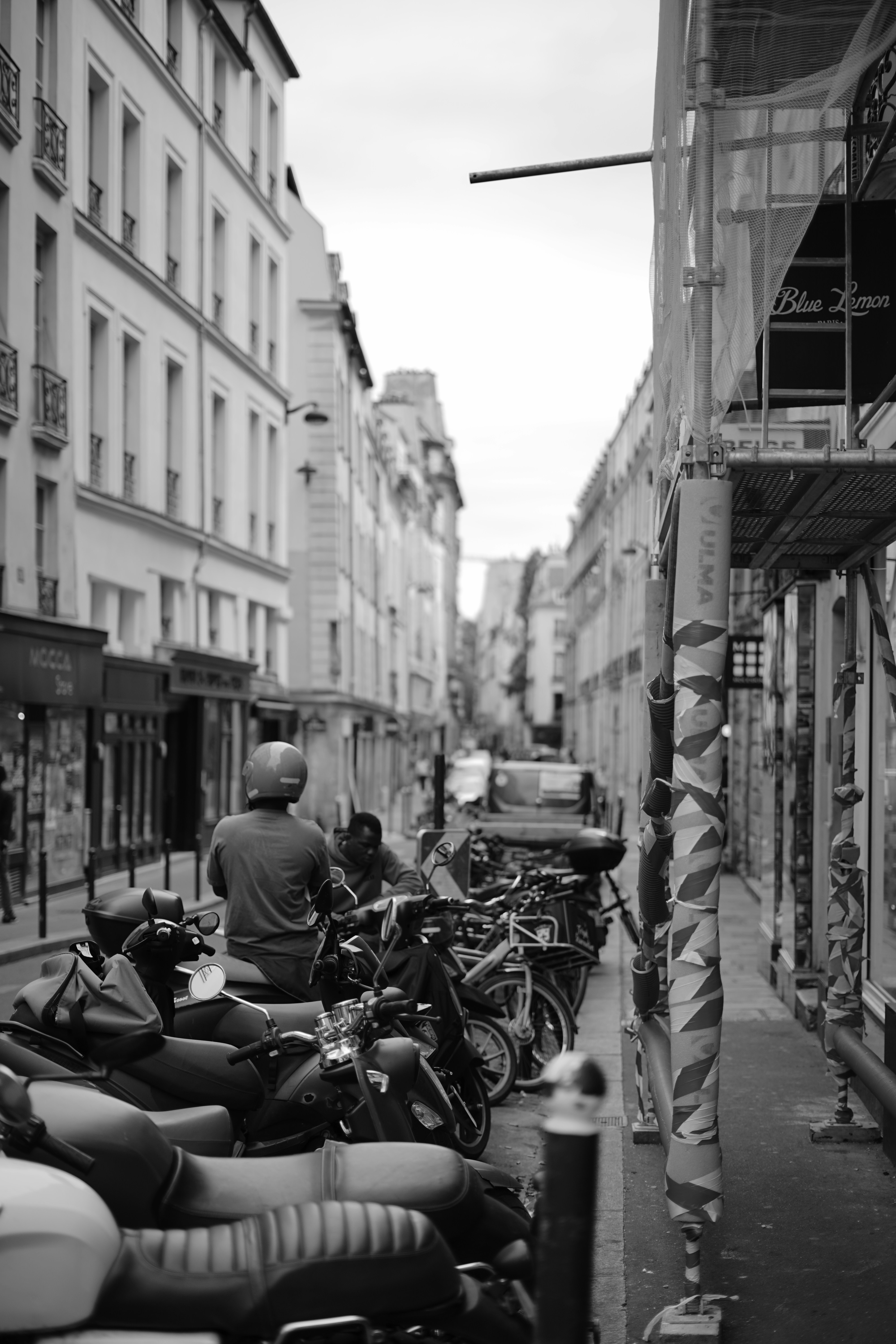 a person on a motorcycle in a city