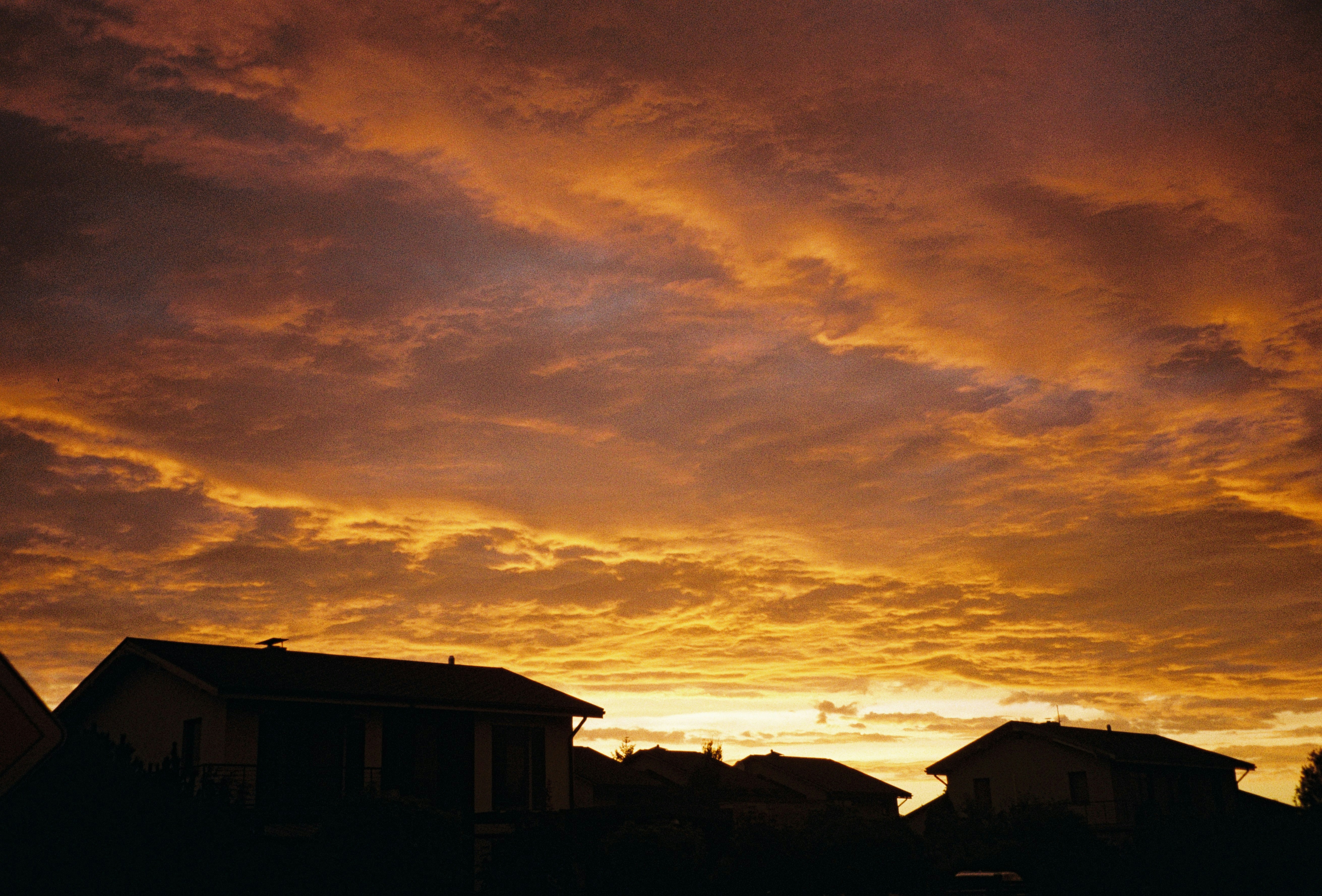 A sunset over houses photo – Free Latvia Image on Unsplash
