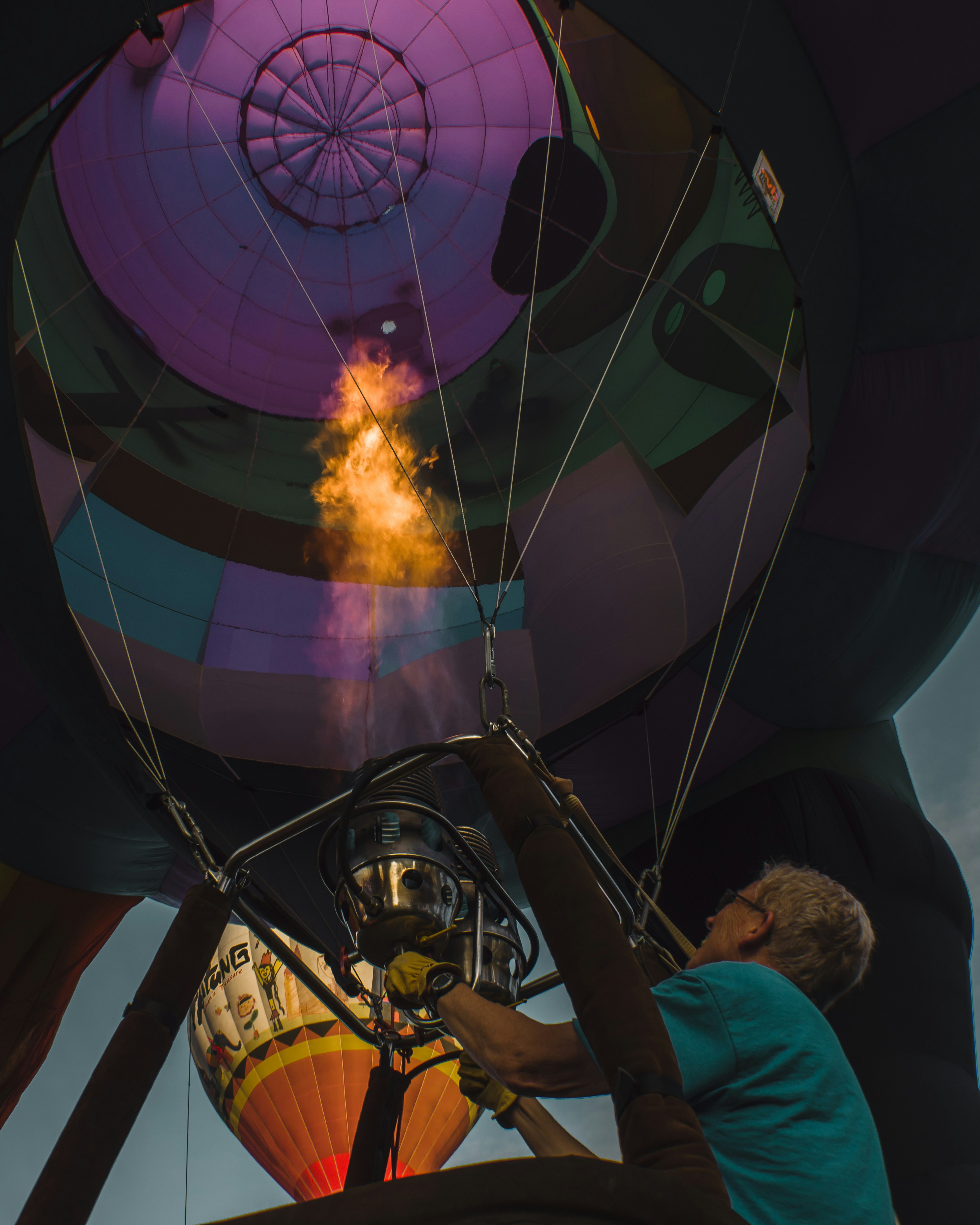 a person fixing a hot air balloon