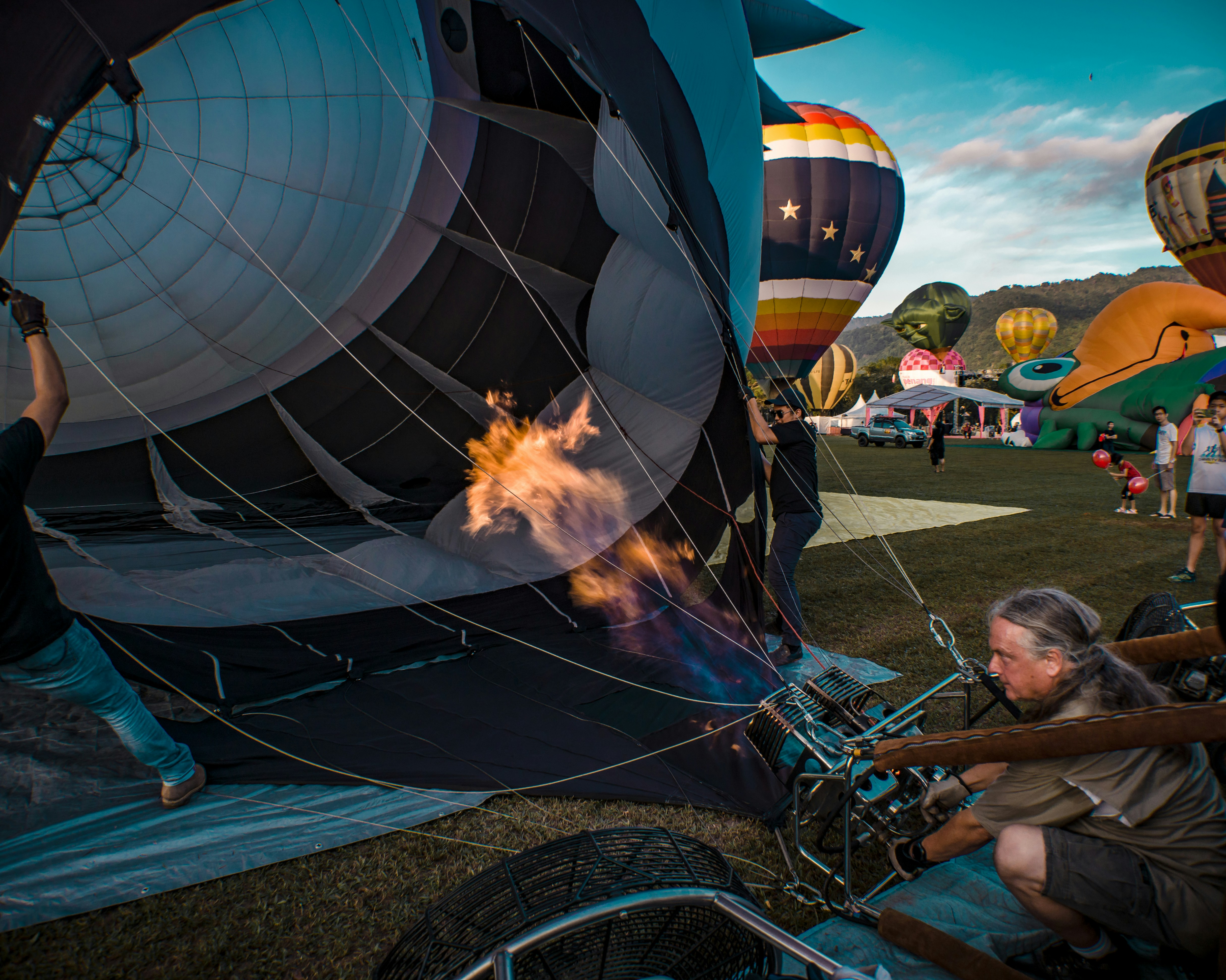 Burner’s Spark: Giants Awake as Hot Air Balloons Prepare to Rise
