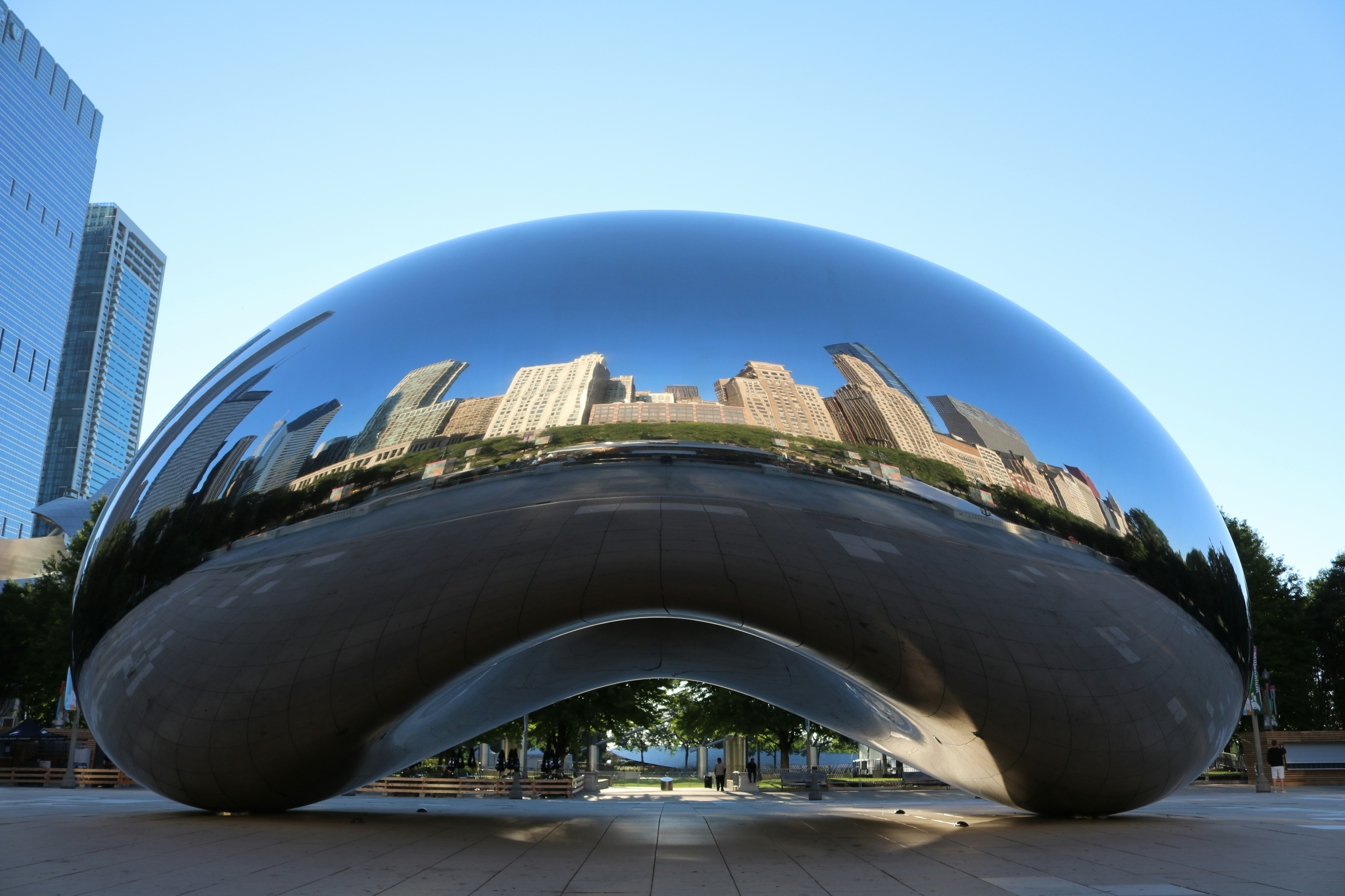 A large reflective sphere with Millennium Park in the background photo ...