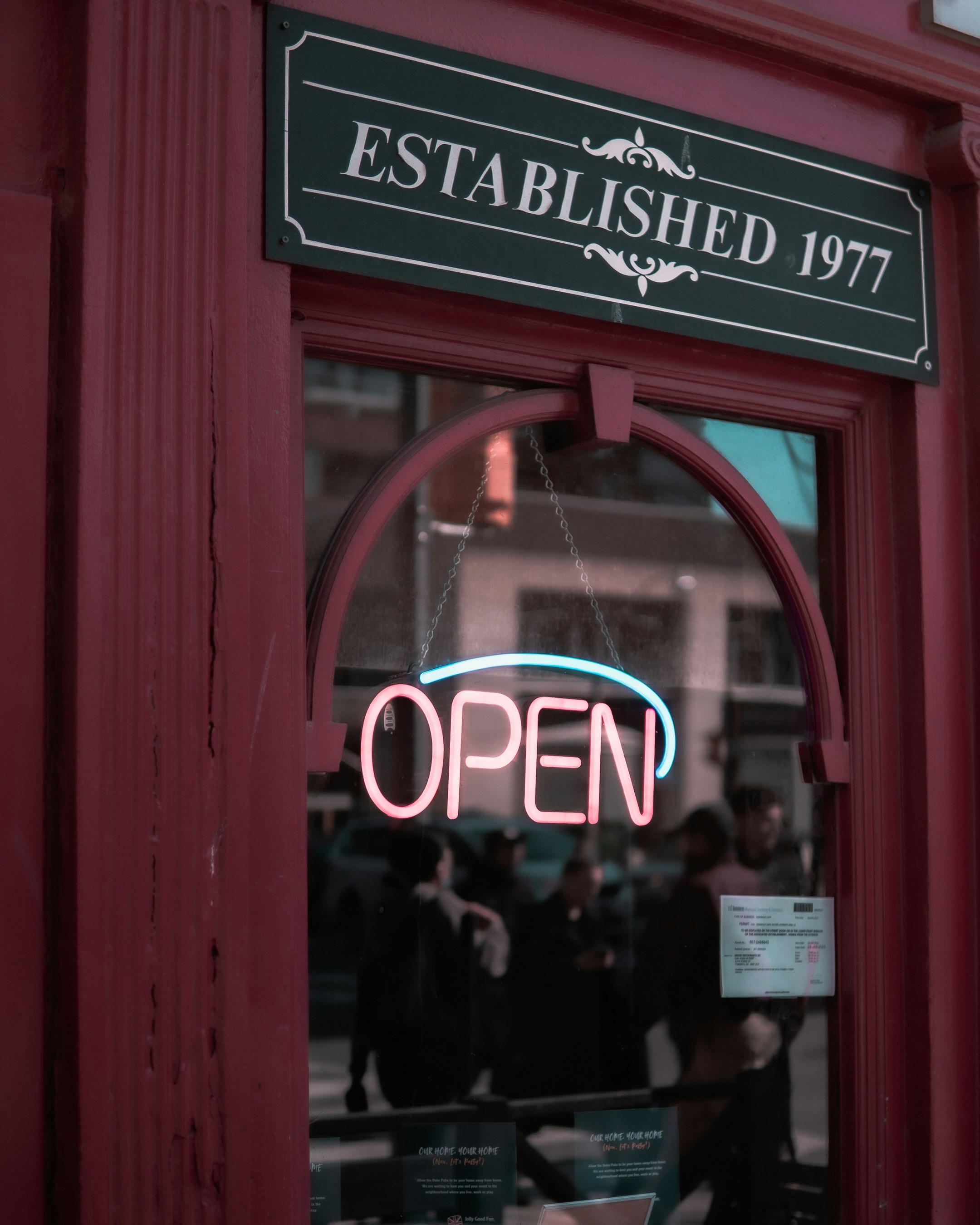 Open Sign, Open Doors: A Neon Welcome by the 1977 Facade