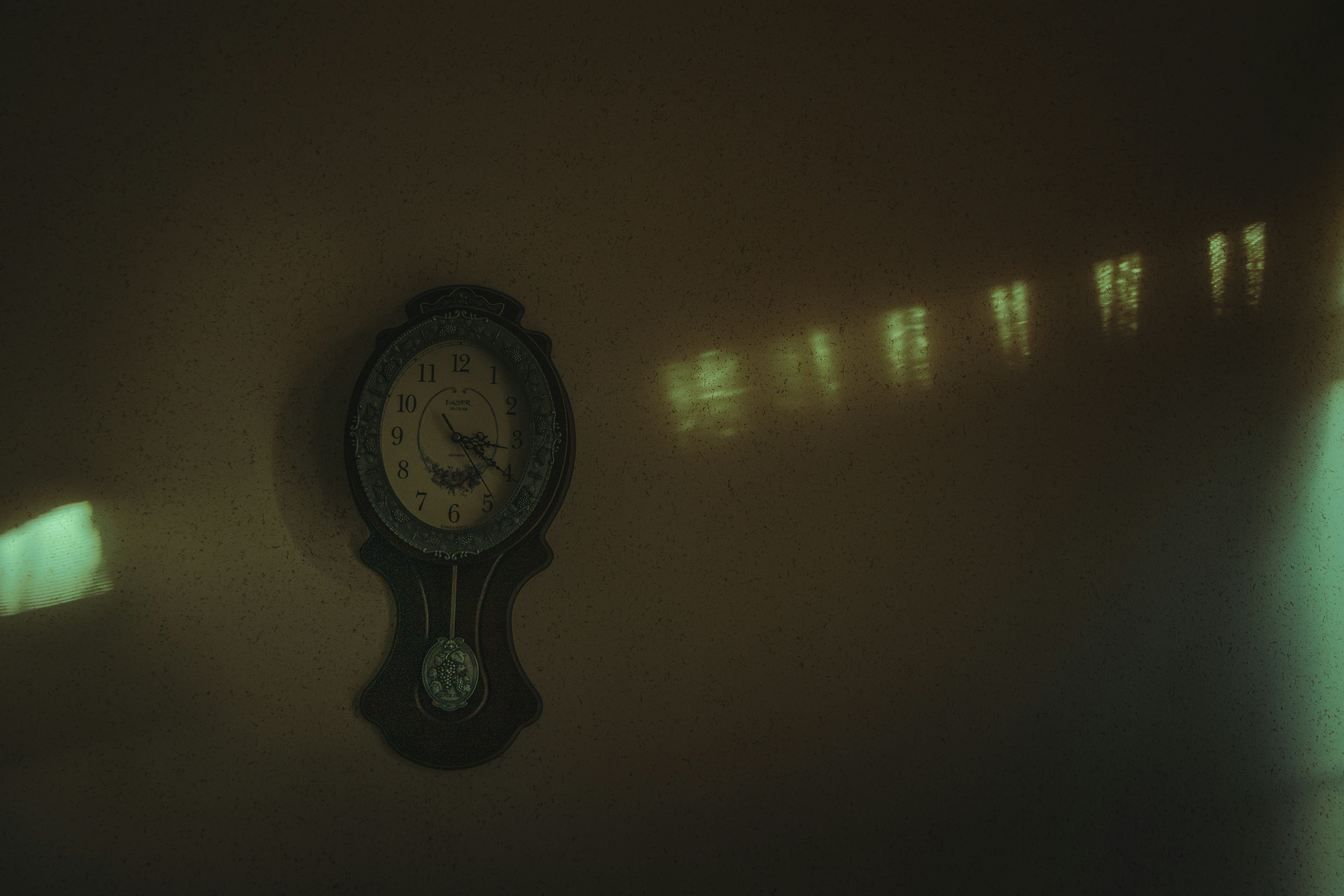 Emerald Light on an Antique Wall Clock