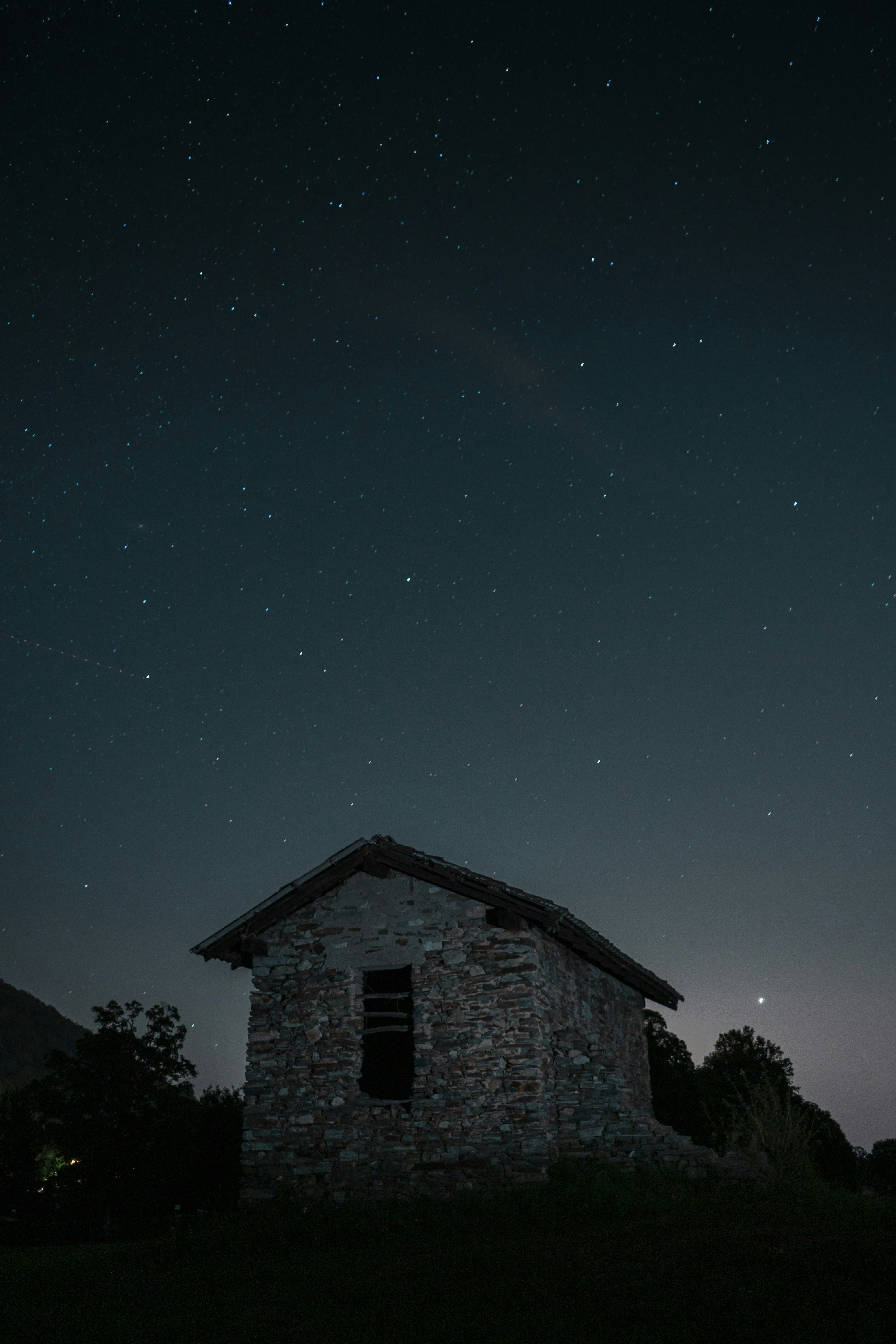 Whispering Stone Hut Under a Sea of Stars