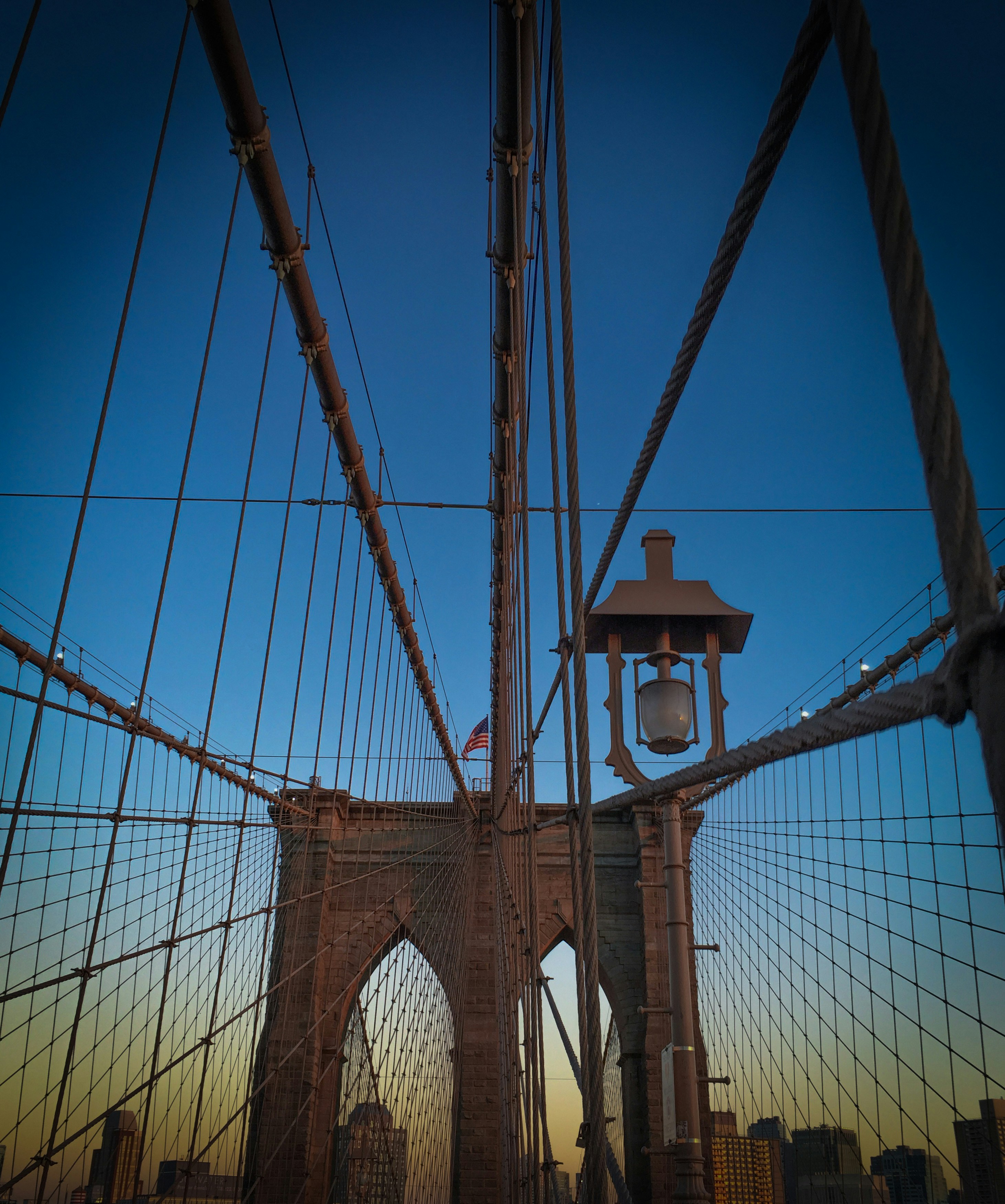 Twilight Convergence Along Brooklyn Bridge: A Tense Web of Cables at Dusk