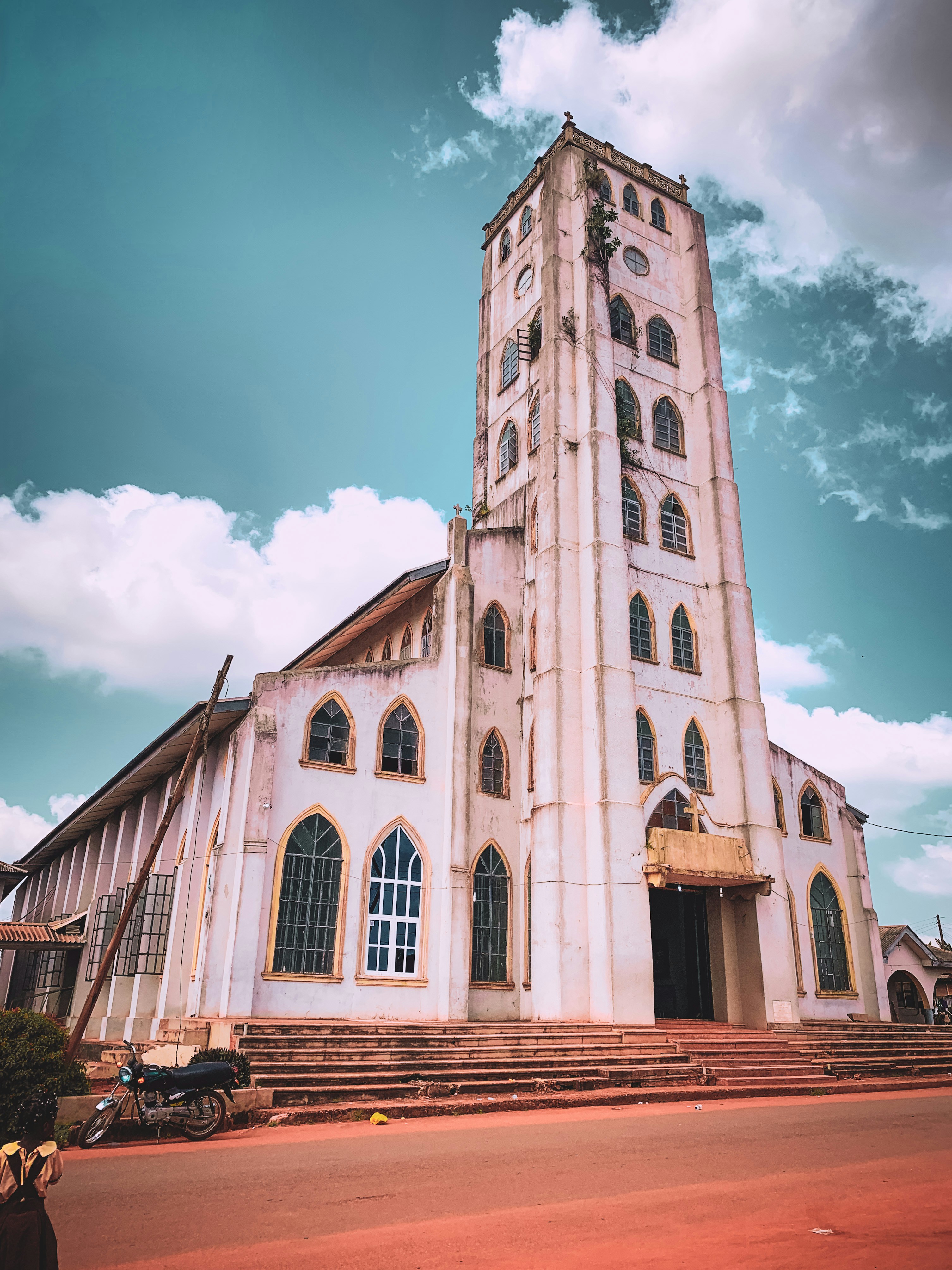 Ascension in White: The Church Tower Reaching Toward a Teal Sky