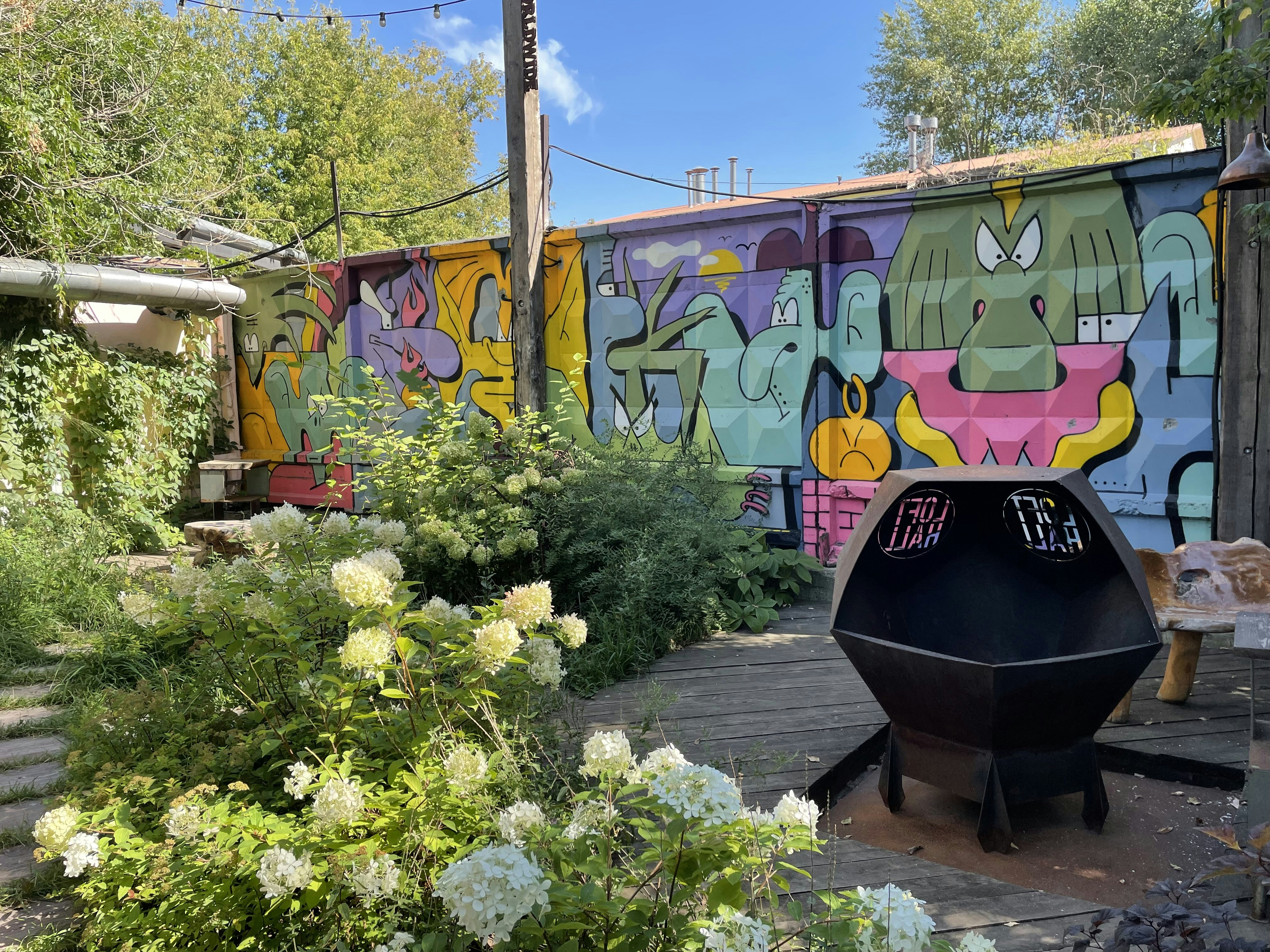 Urban Graffiti Courtyard with Metallic Chimera