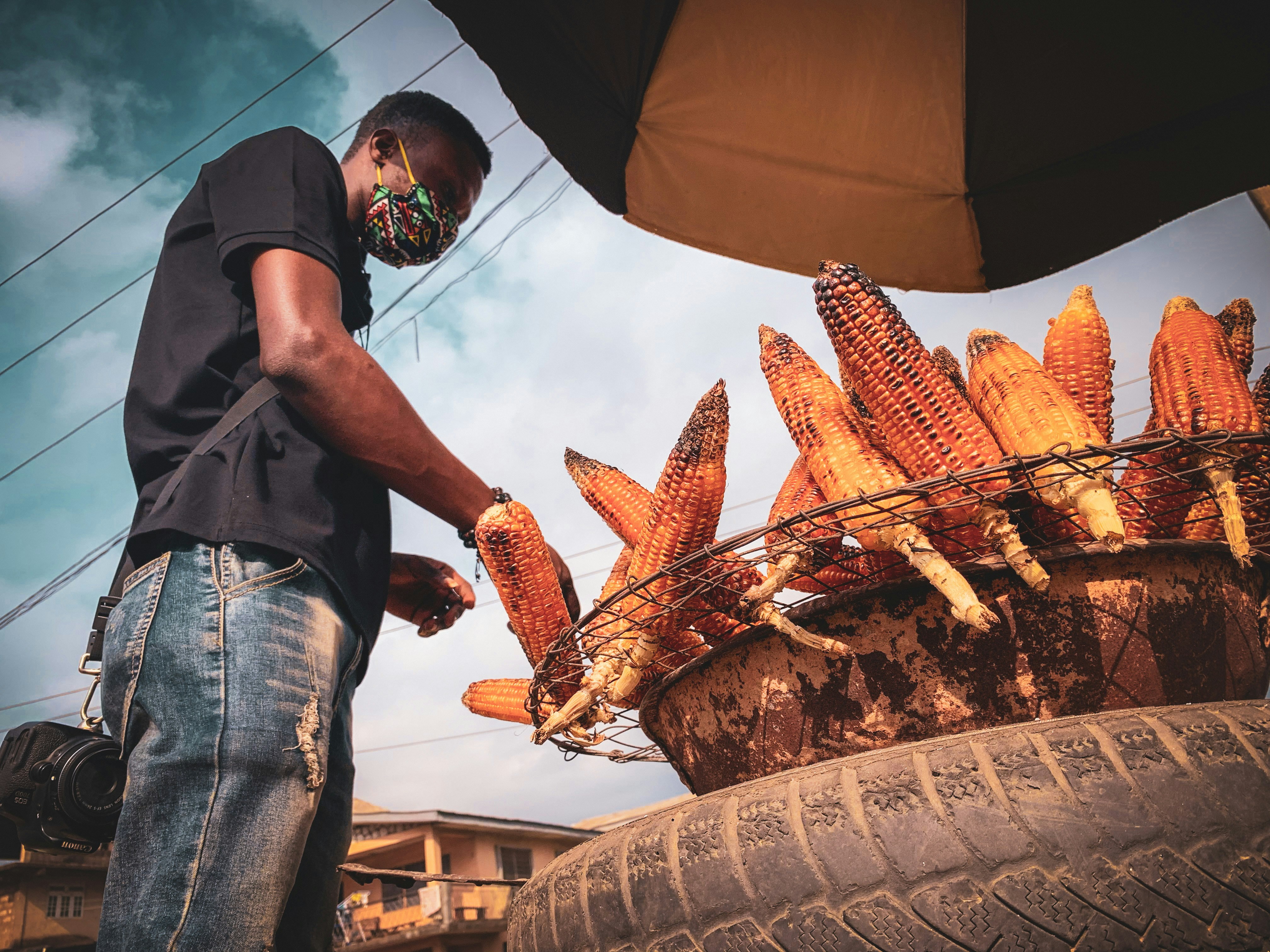 Corn Under Cover: a Street Vendor Tends the Grill