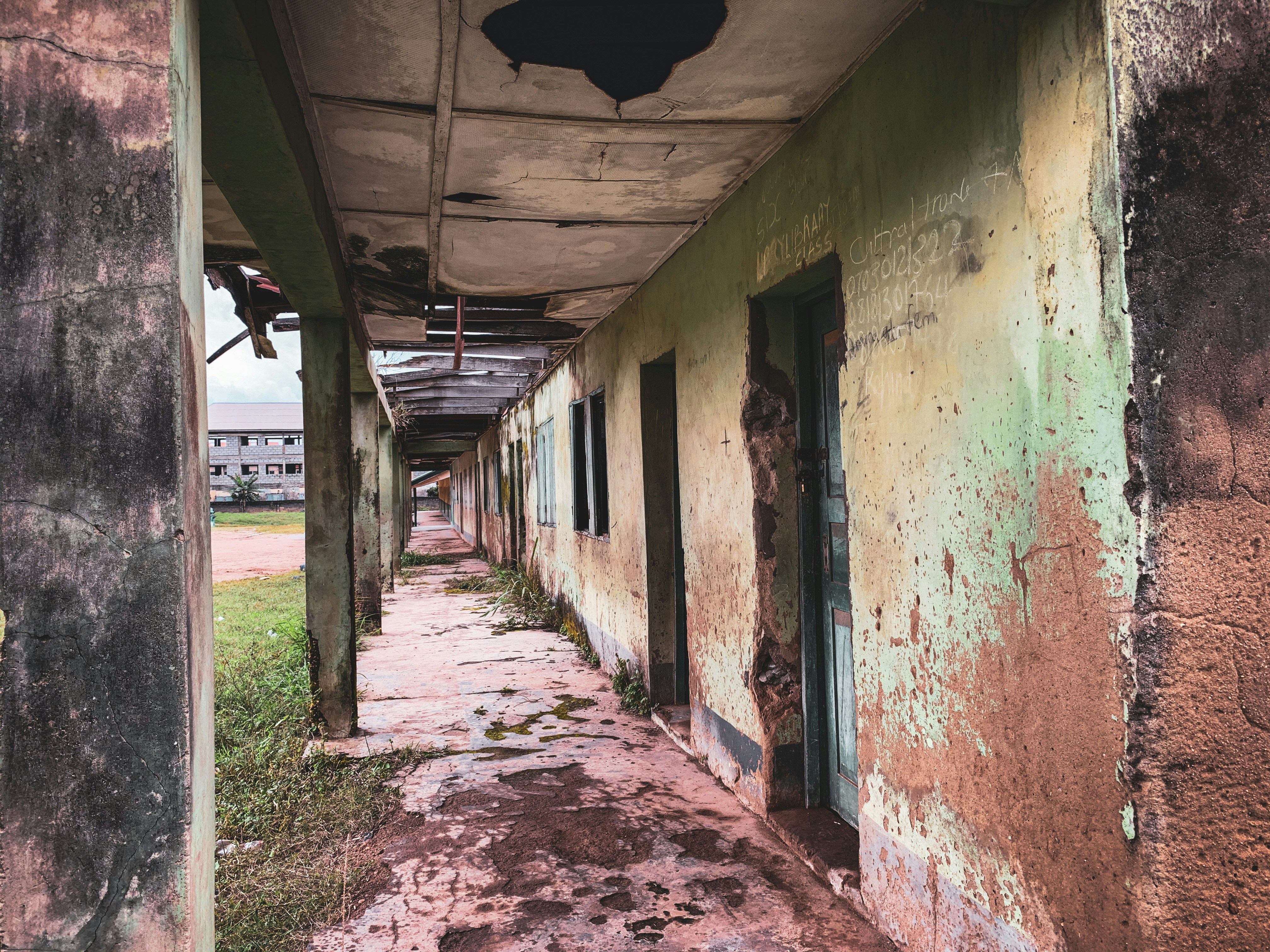 An alley way with brick walls photo – Free Corridor Image on Unsplash