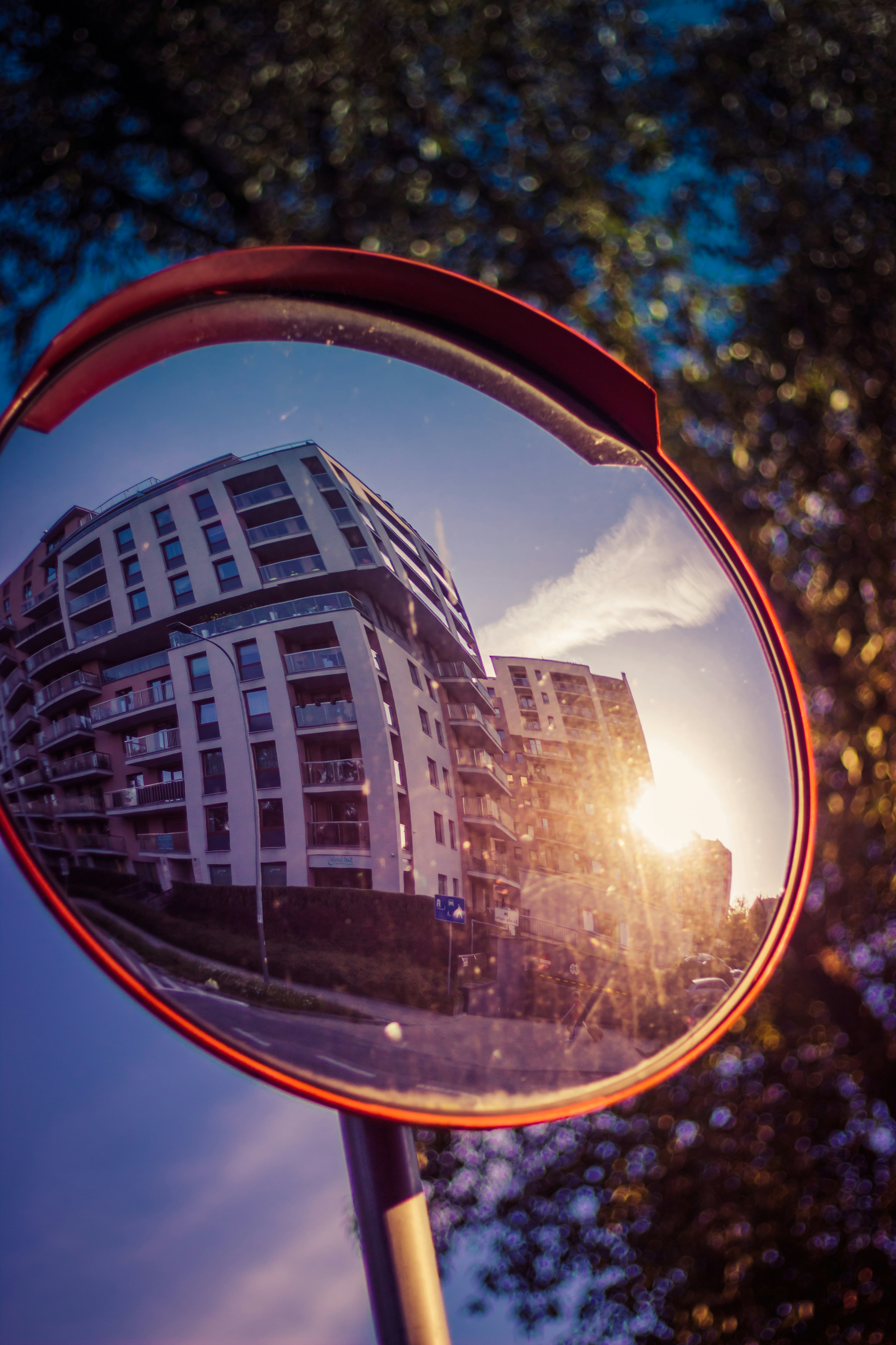 A mirror showing a tall building photo – Free Grey Image on Unsplash