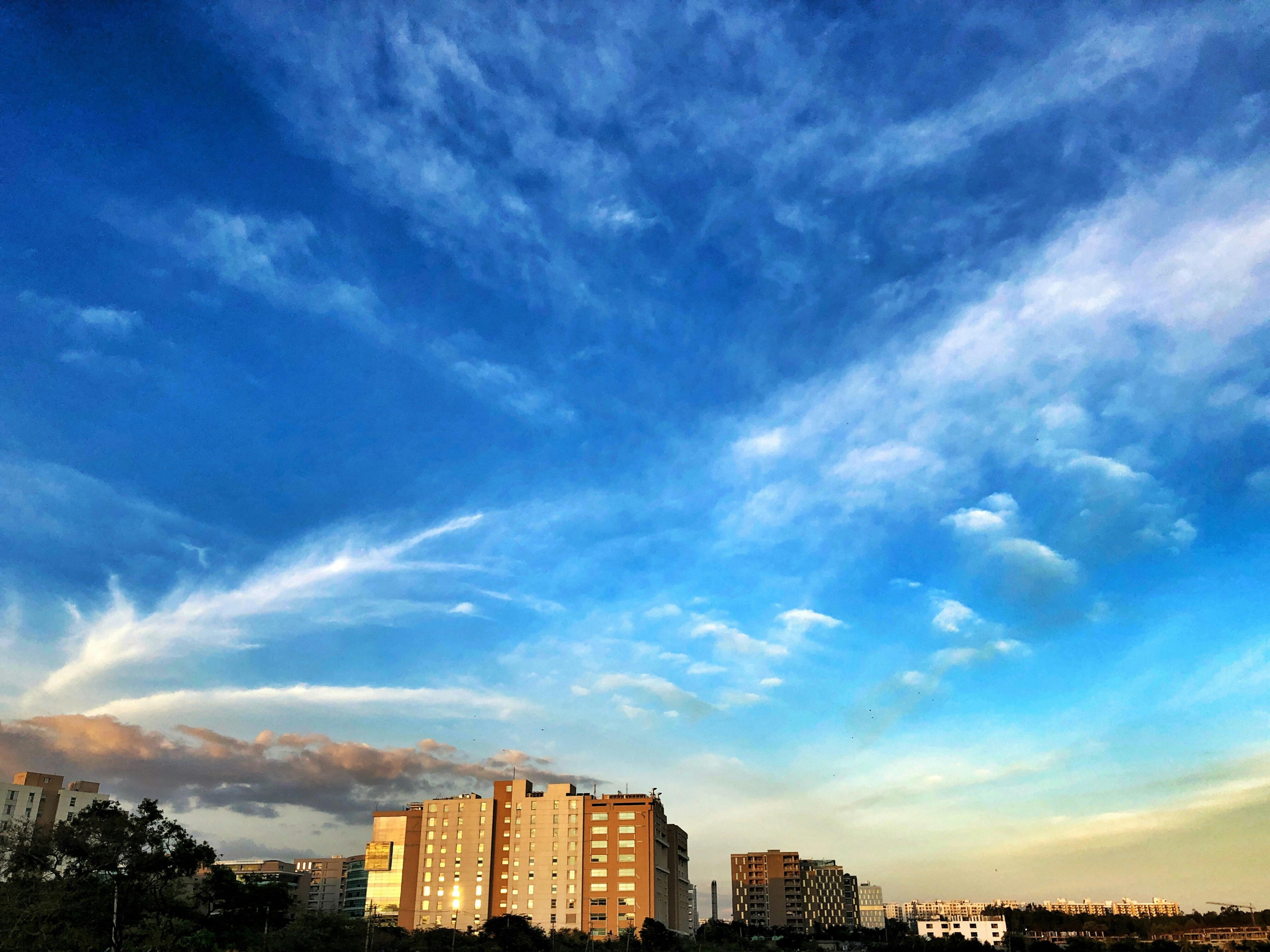 Cerulean Sky Over Sunlit Apartment Row