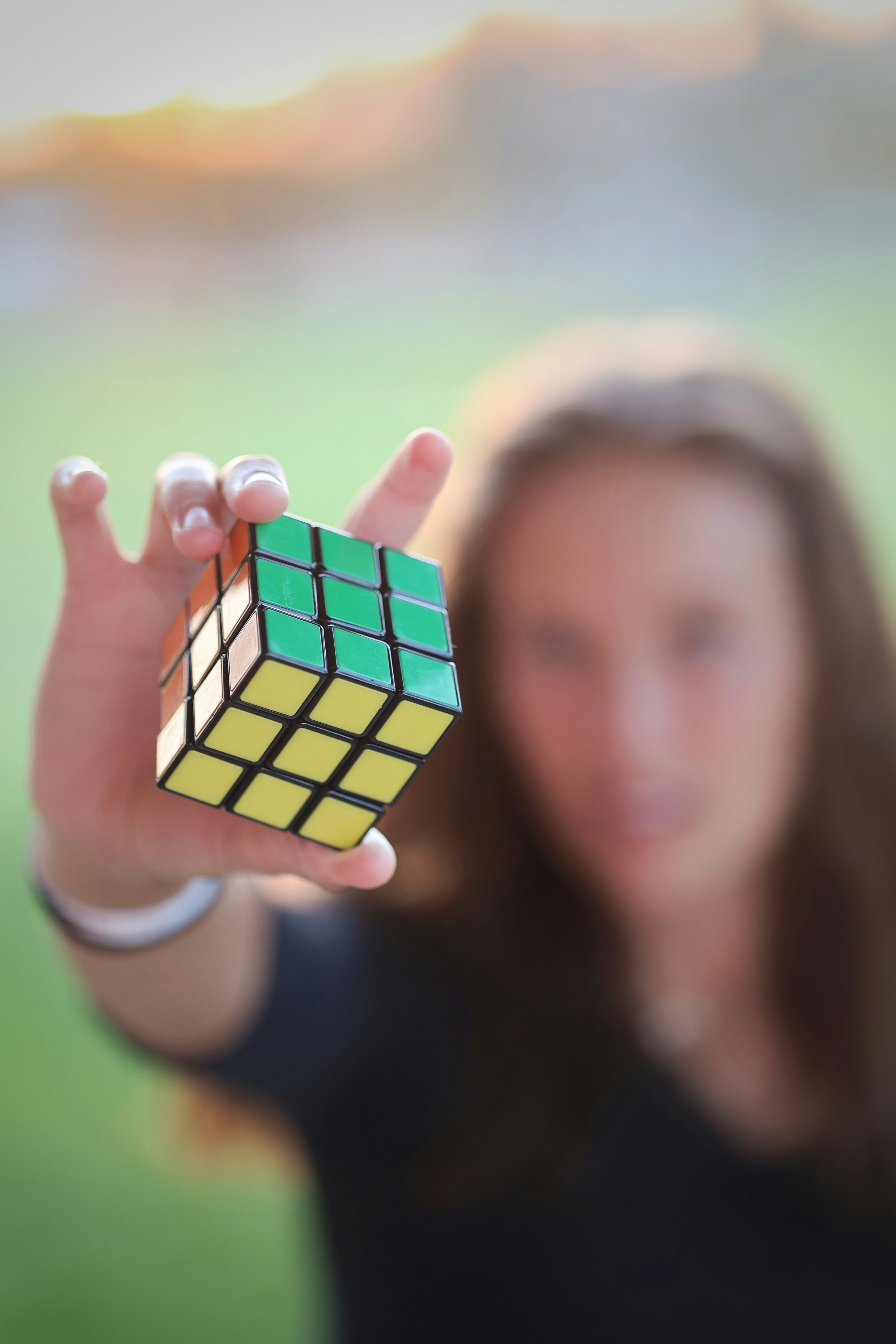 A person holding a cube photo – Free Person Image on Unsplash