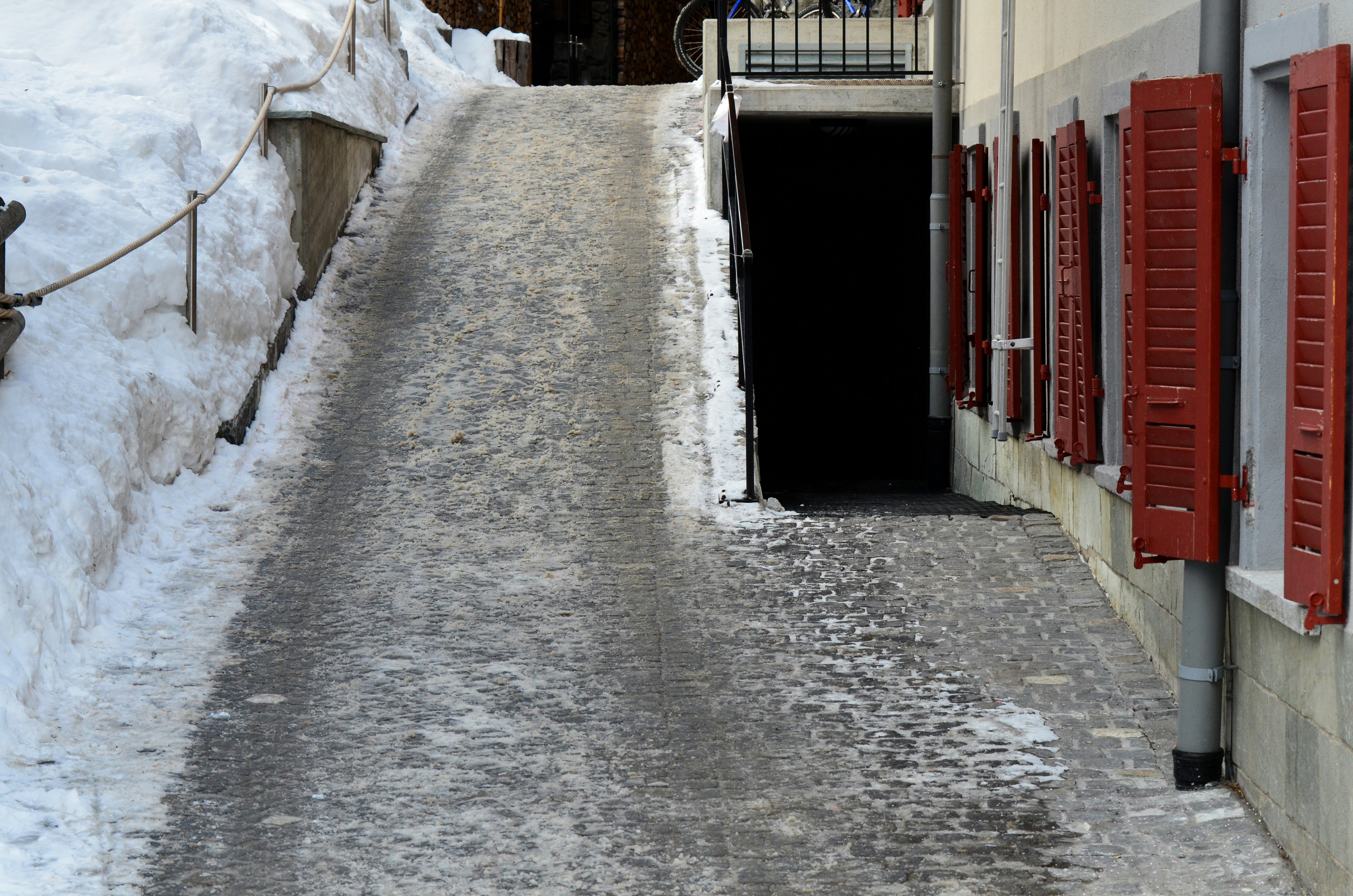 Snow-washed alley to a dark doorway