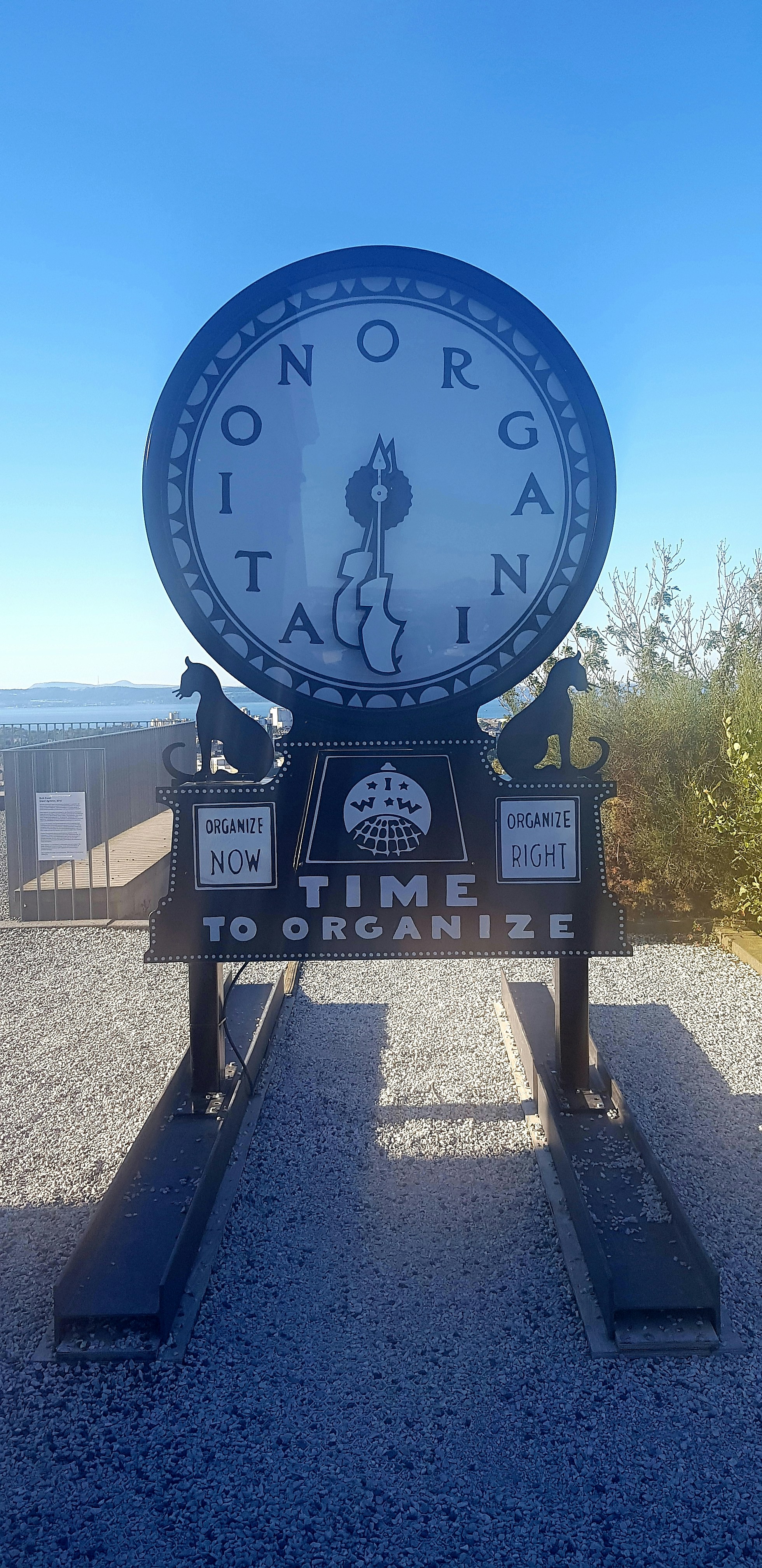 a clock on a pole