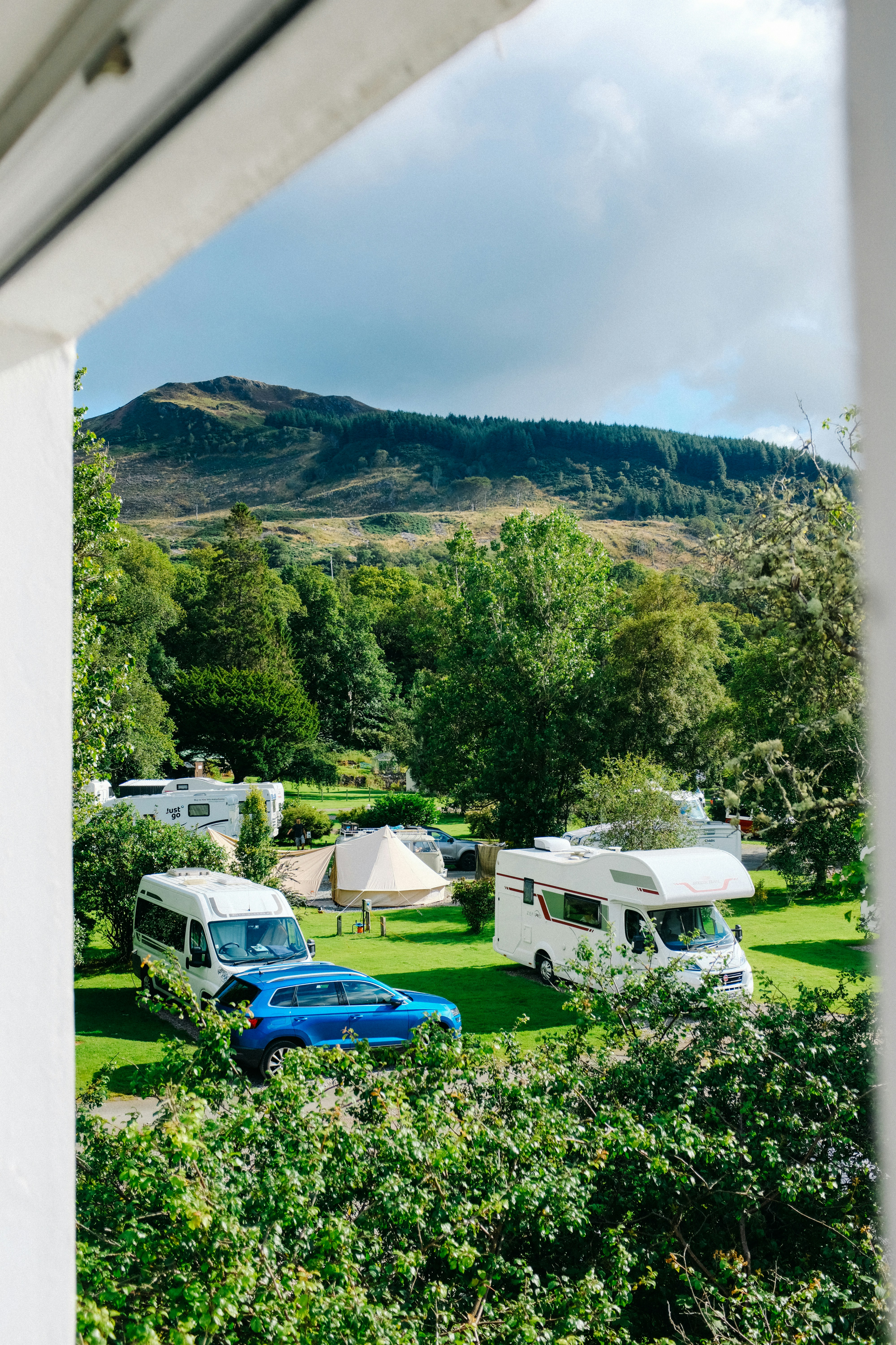 Sunlit Campground Framed by Courtyard Columns