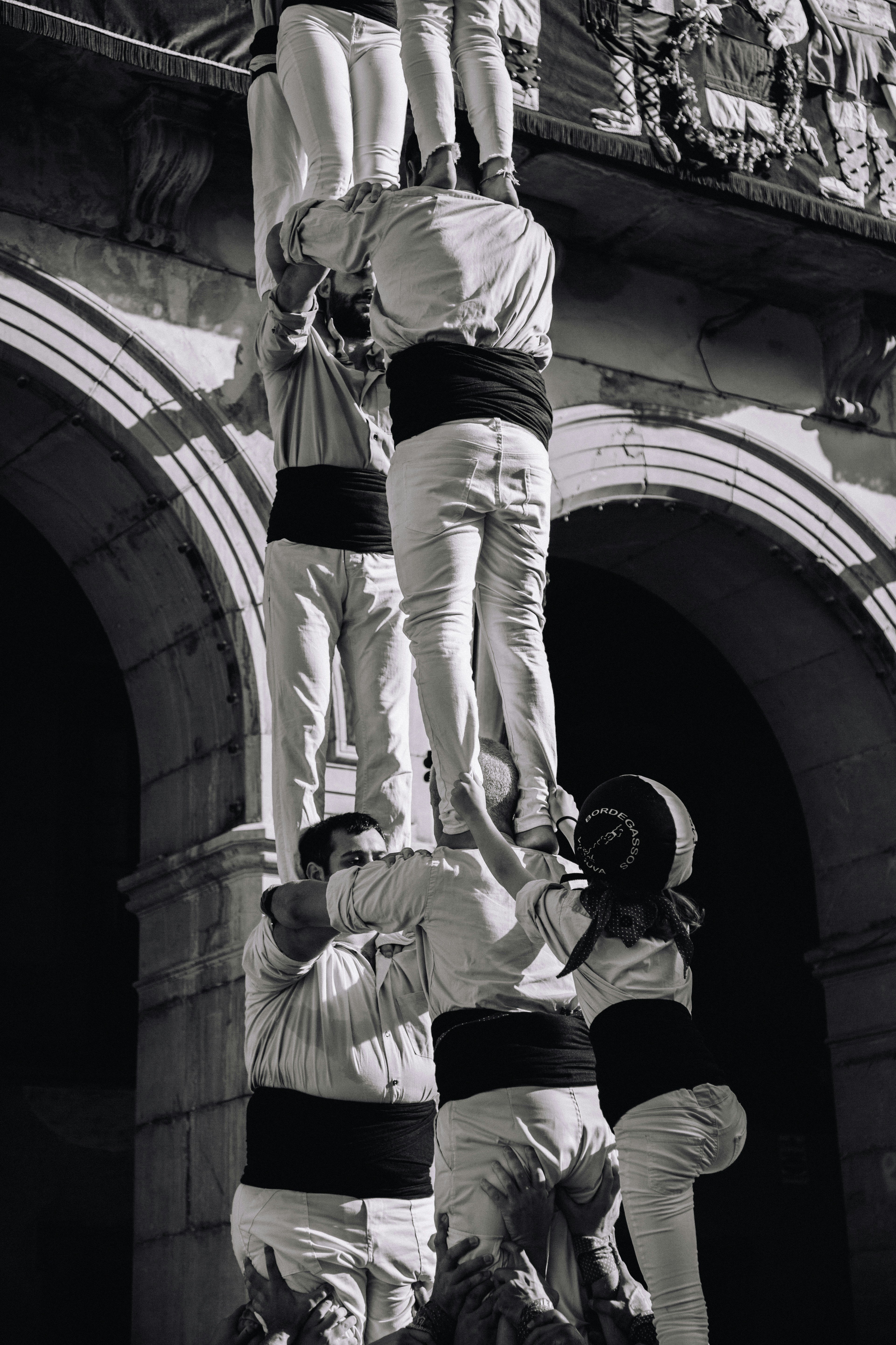 A group of people climbing a building photo – Free Catalonia Image on ...