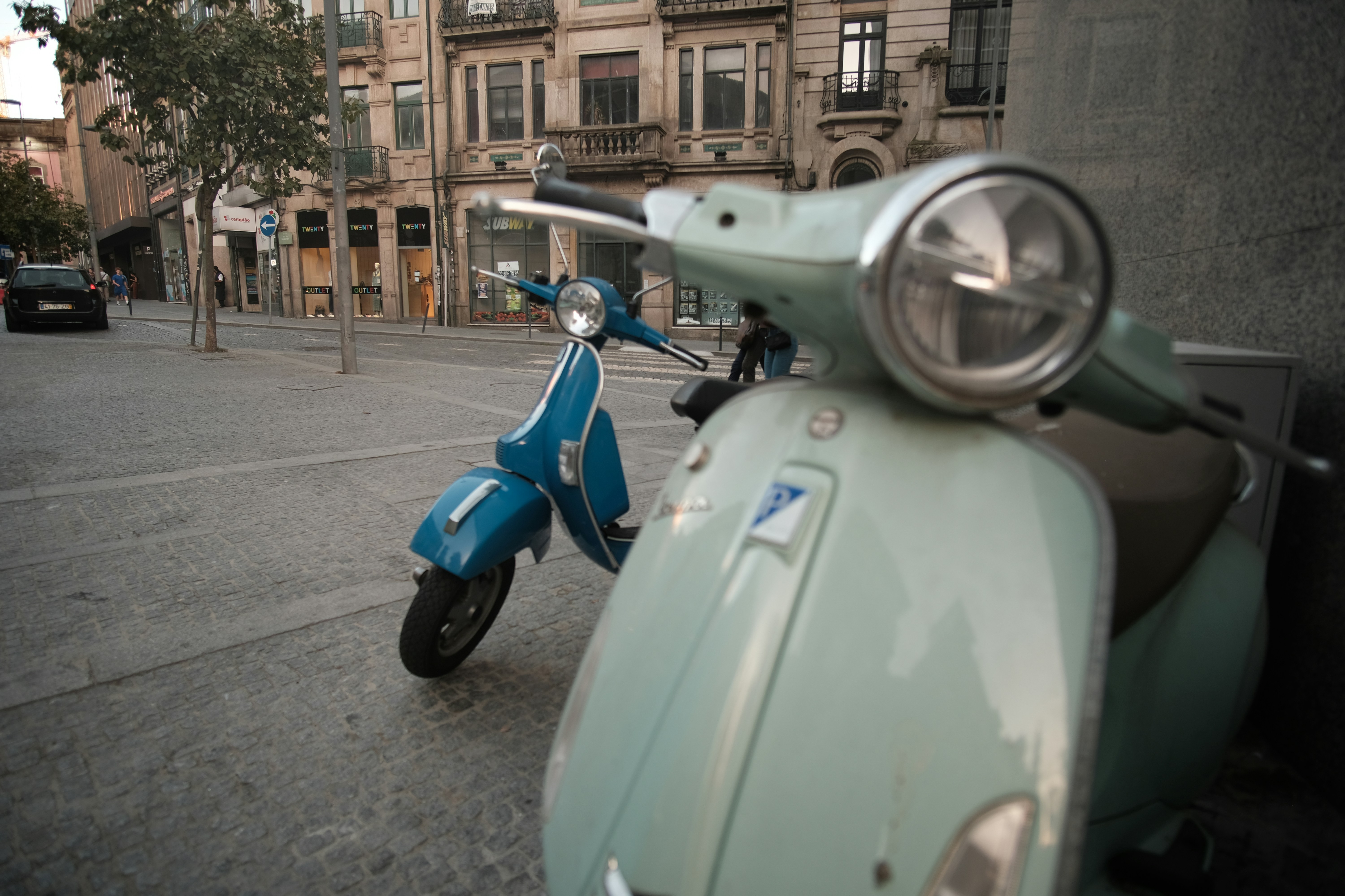 Mint Vespa in the City: Curves, Pastels, and Quiet Street Charms