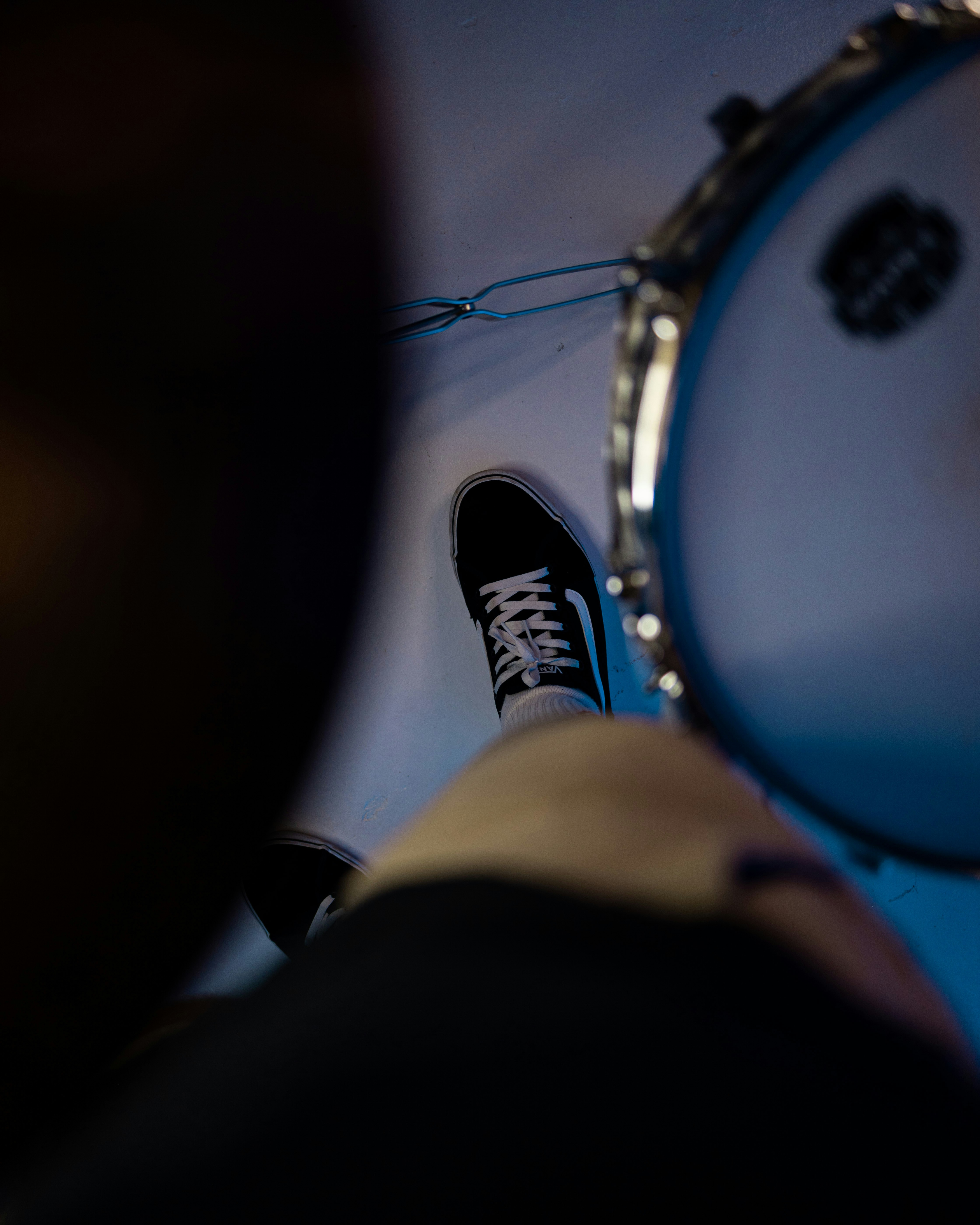 Top-Down Beat: A Blue Sneaker Anchoring the Drum Kit
