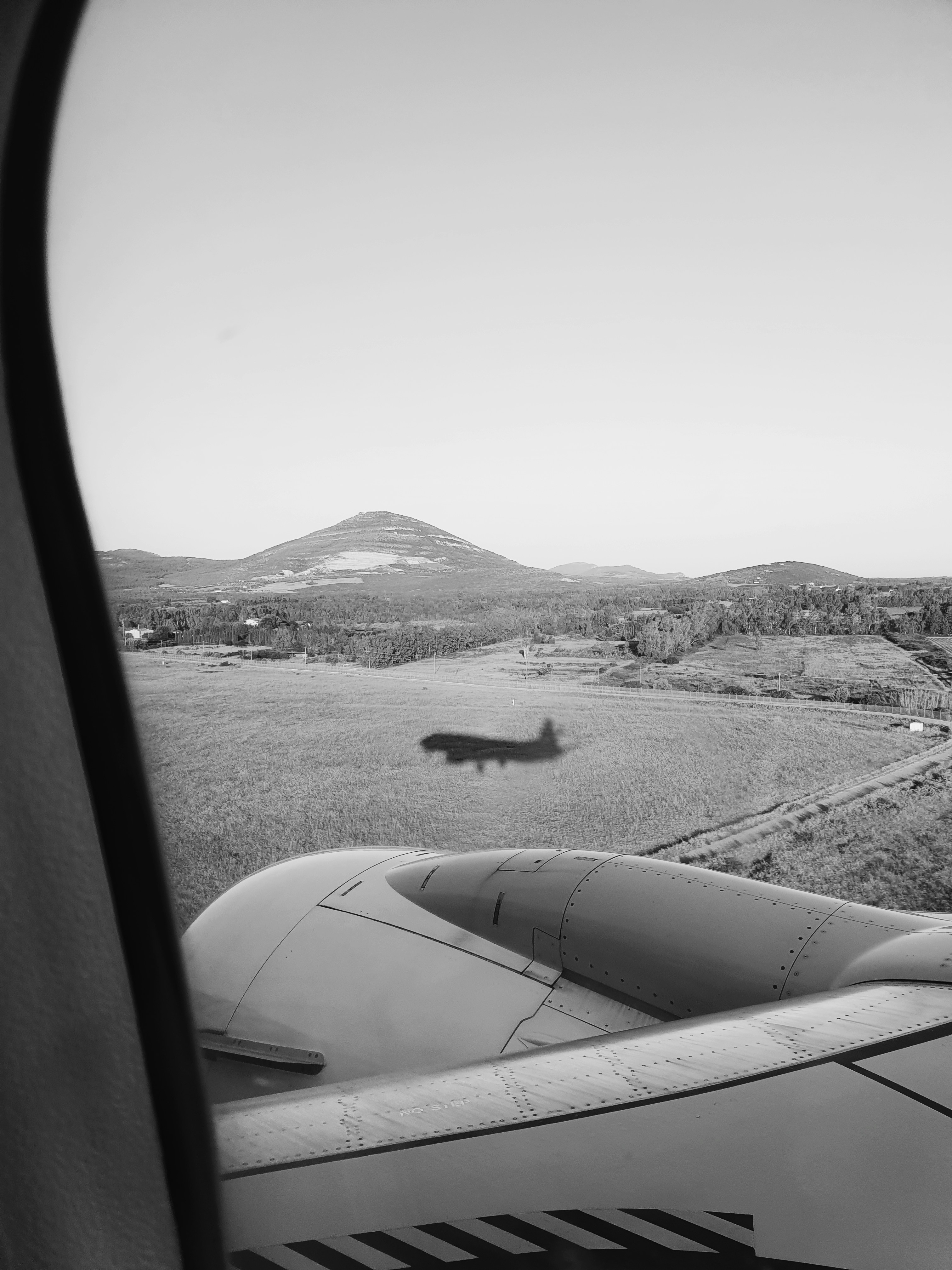 Wing-Seat Vista: Shadow Across the Quiet Plains