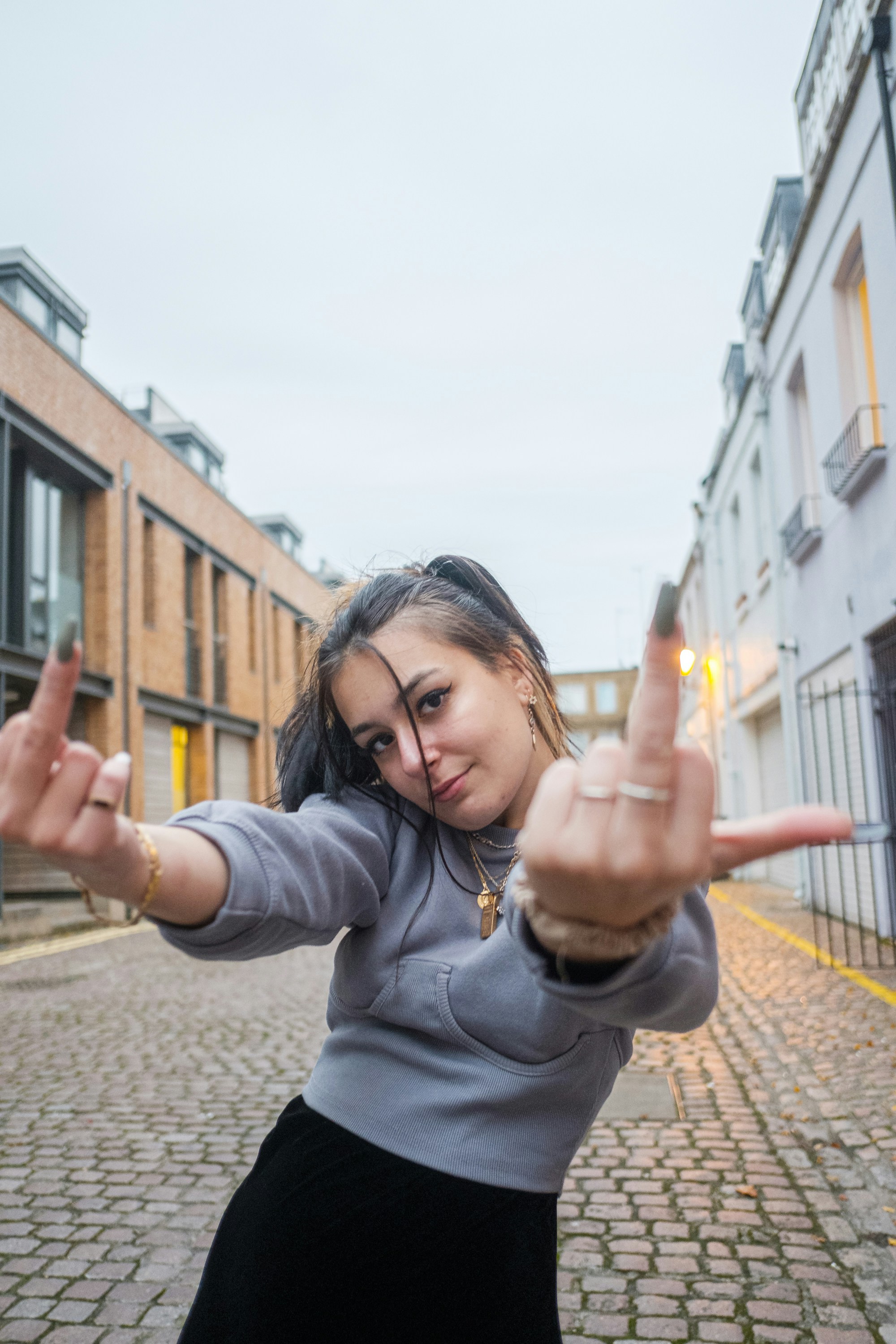 A person holding up the middle finger photo – Free Girl Image on Unsplash