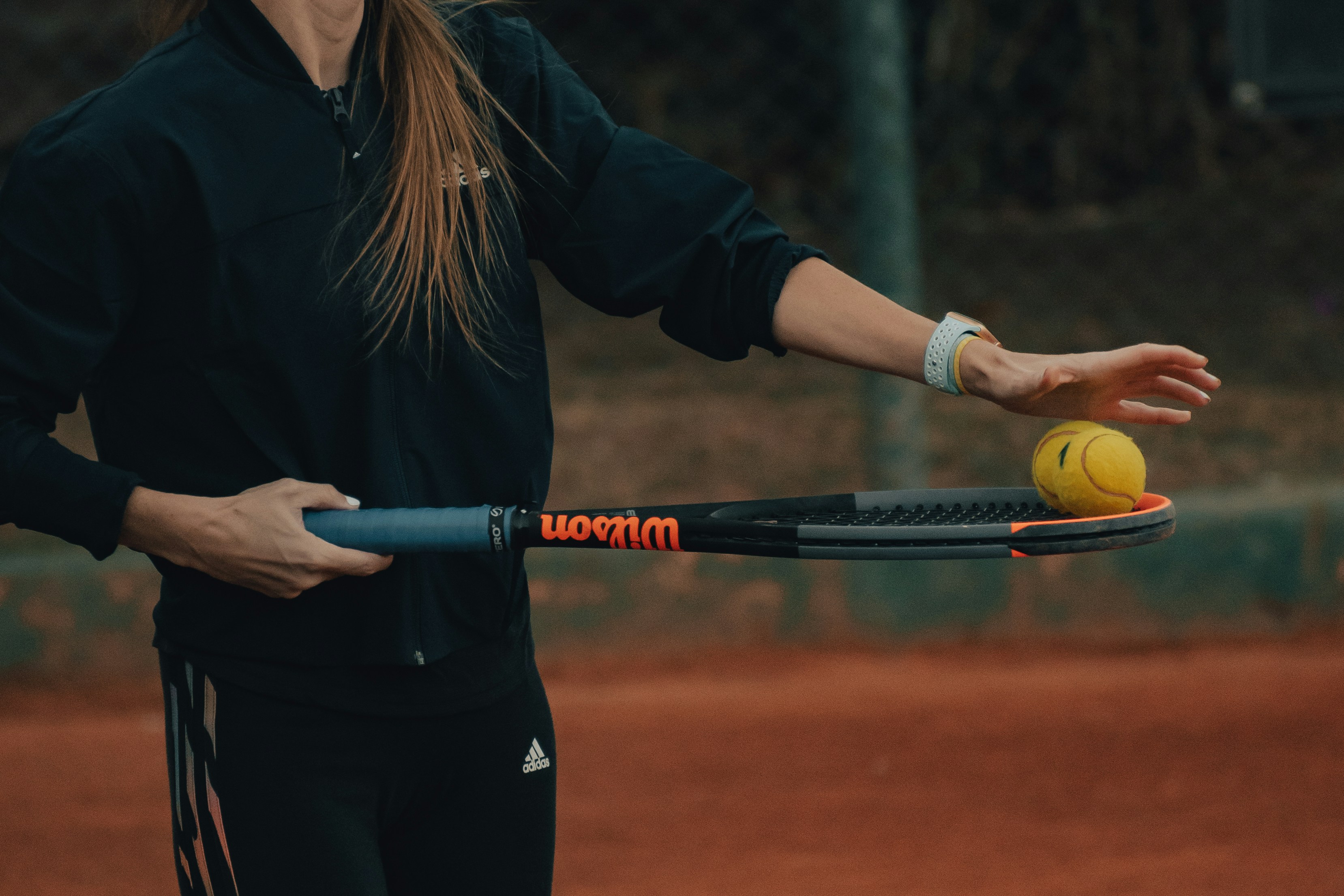 A person hitting a ball with a tennis racket photo – Free Human Image ...