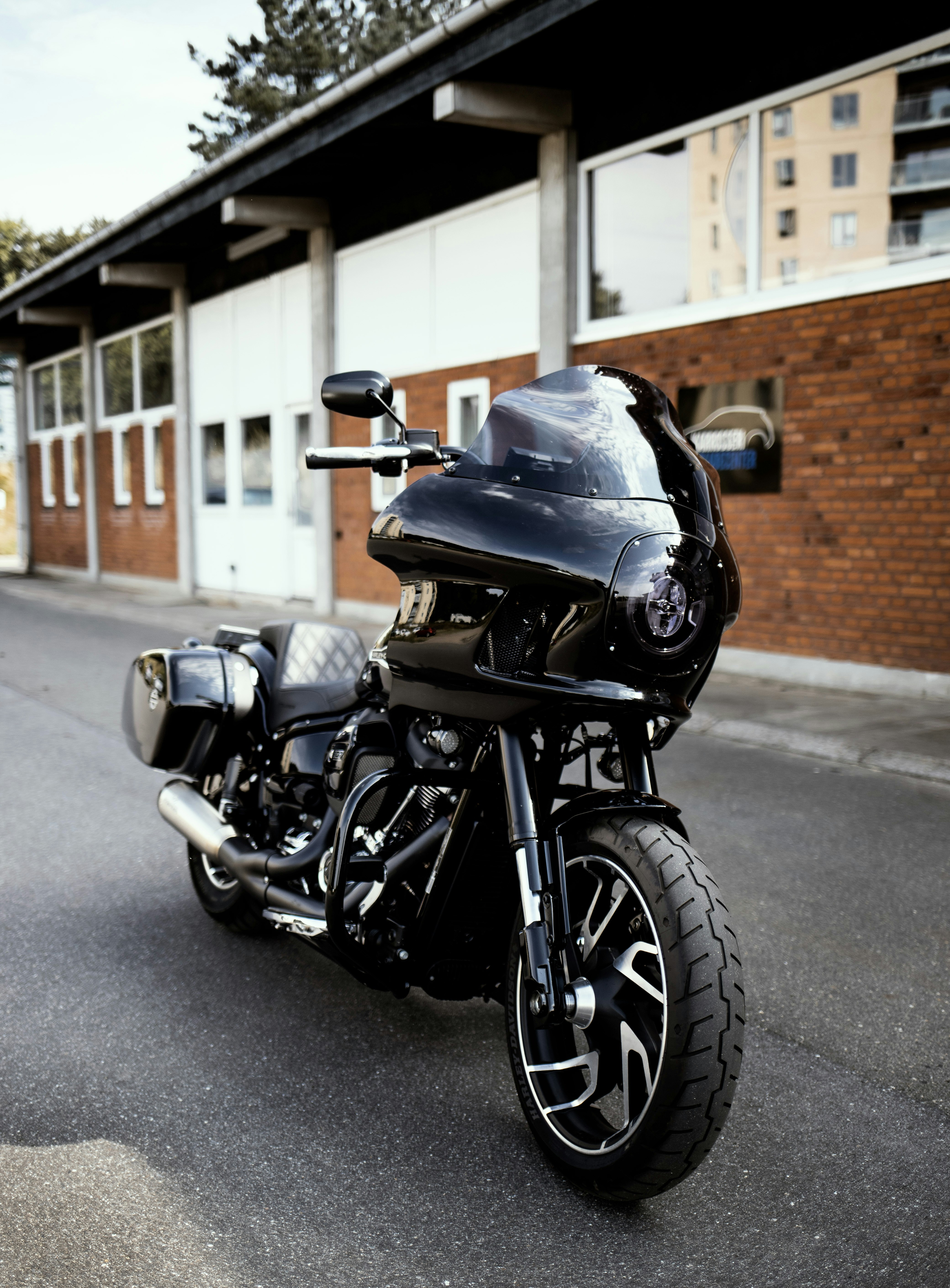 A motorcycle parked on the side of a street photo – Free Denmark Image ...