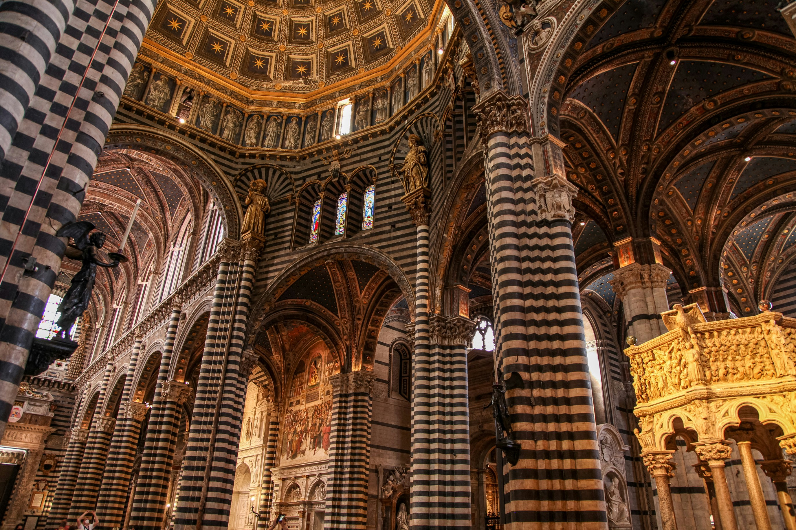 A large ornate building with many arches photo – Free Duomo di siena ...