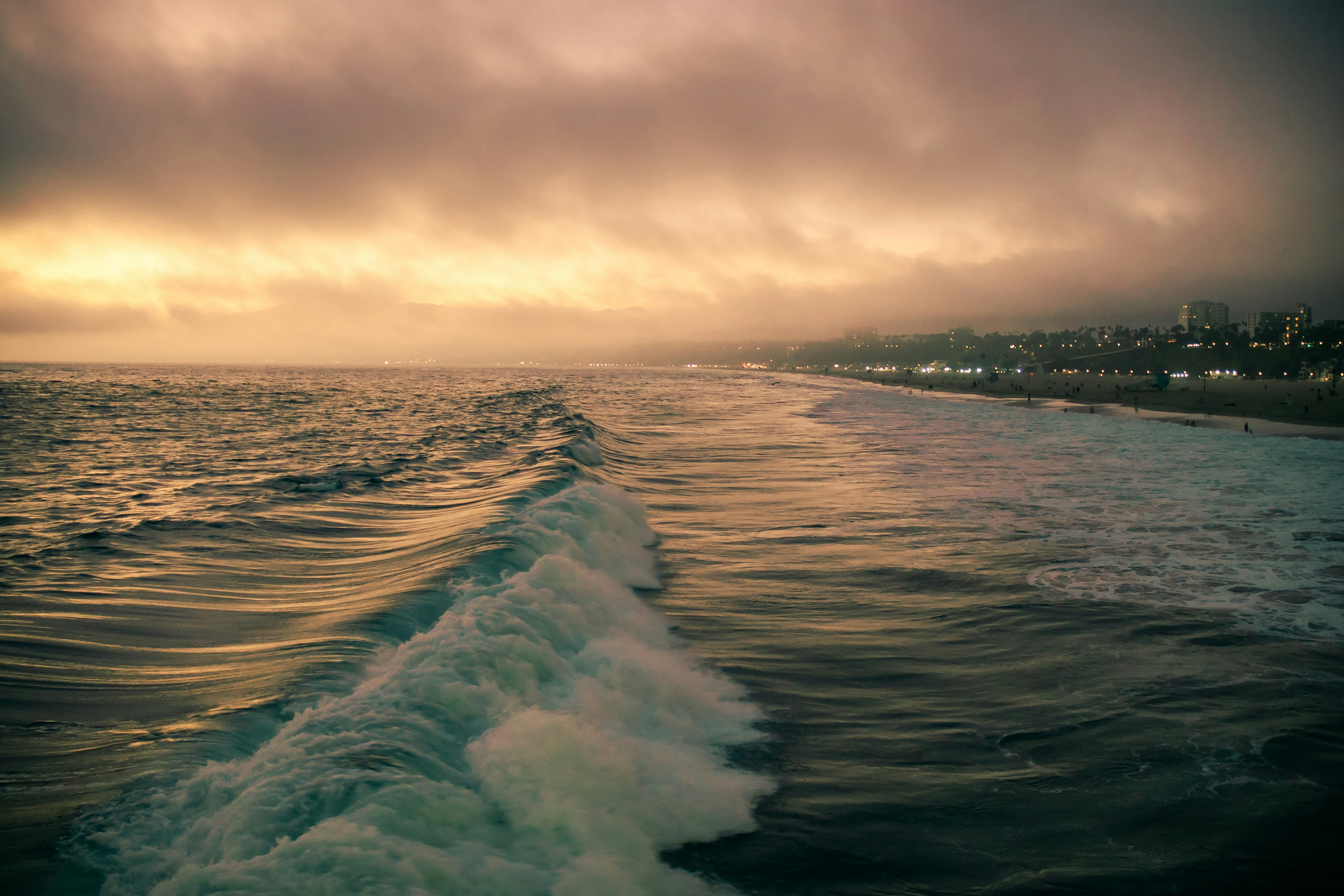 Foam Crest at Dusk: A Wave's Path Toward a Quiet Coast