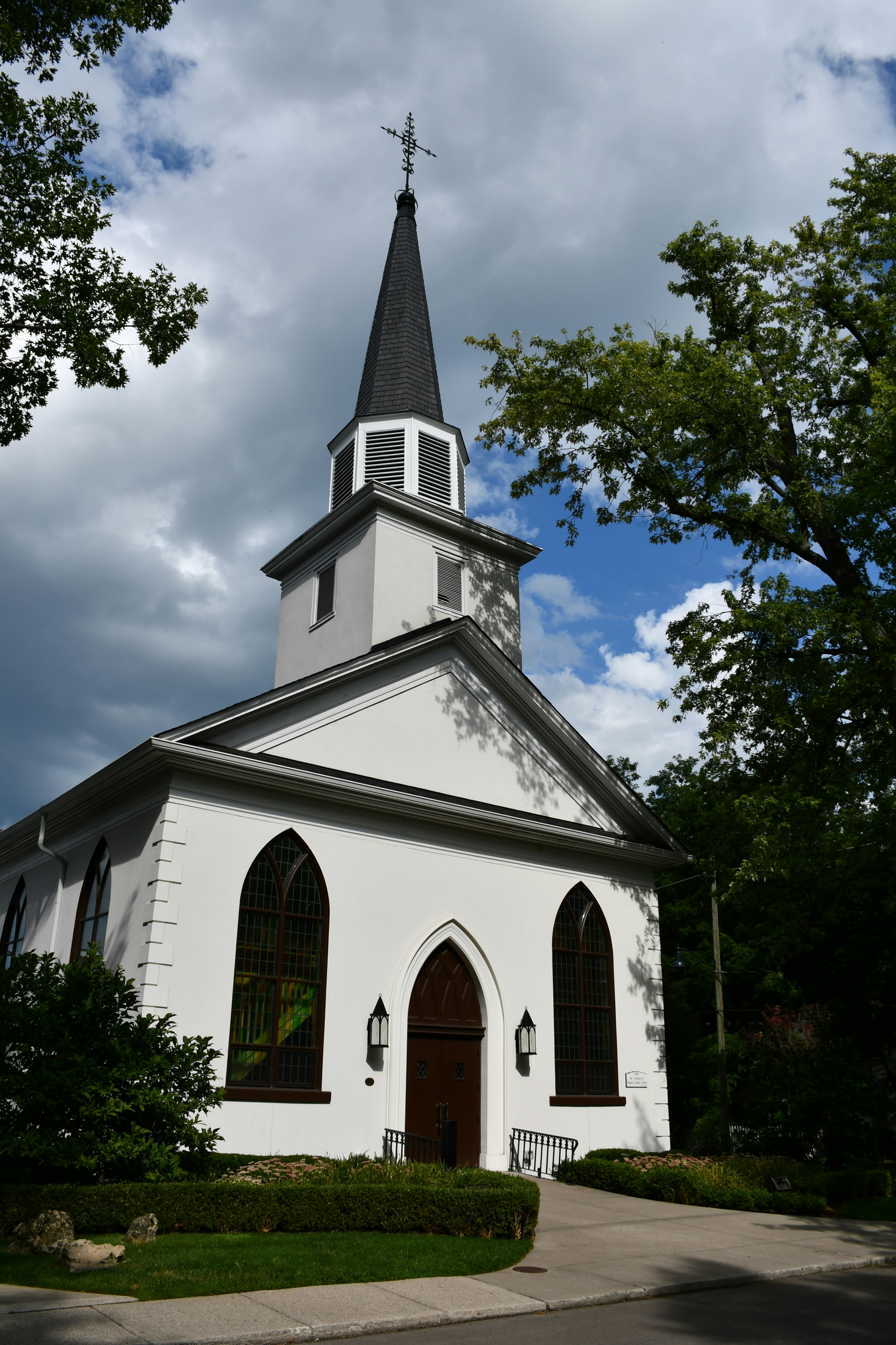 A white church with a cross on top with Confederate Memorial Chapel in ...