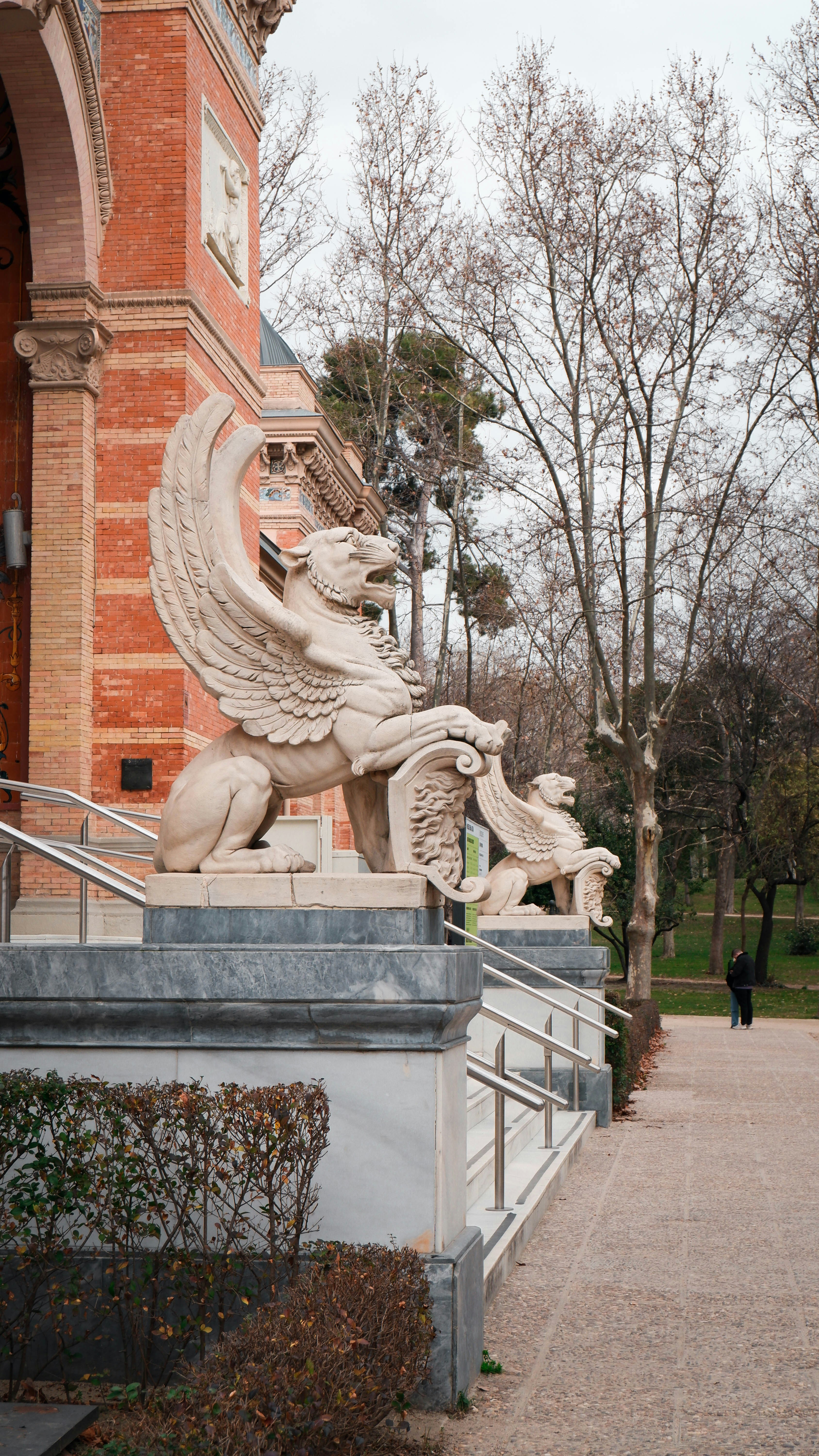 Winged Griffin Guardians Guard the Red-Brick Staircase