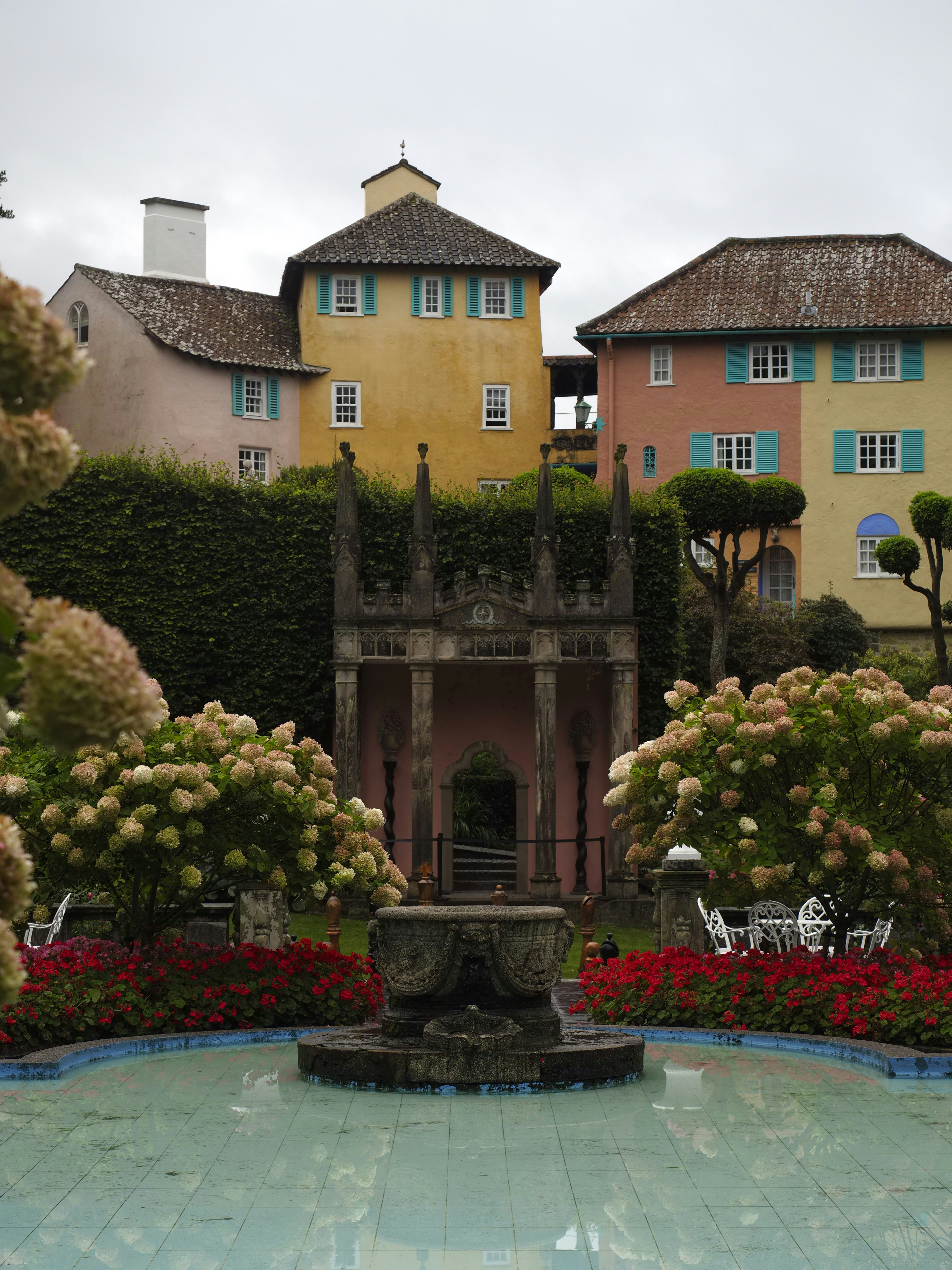 Pastel Village Courtyard with Central Fountain