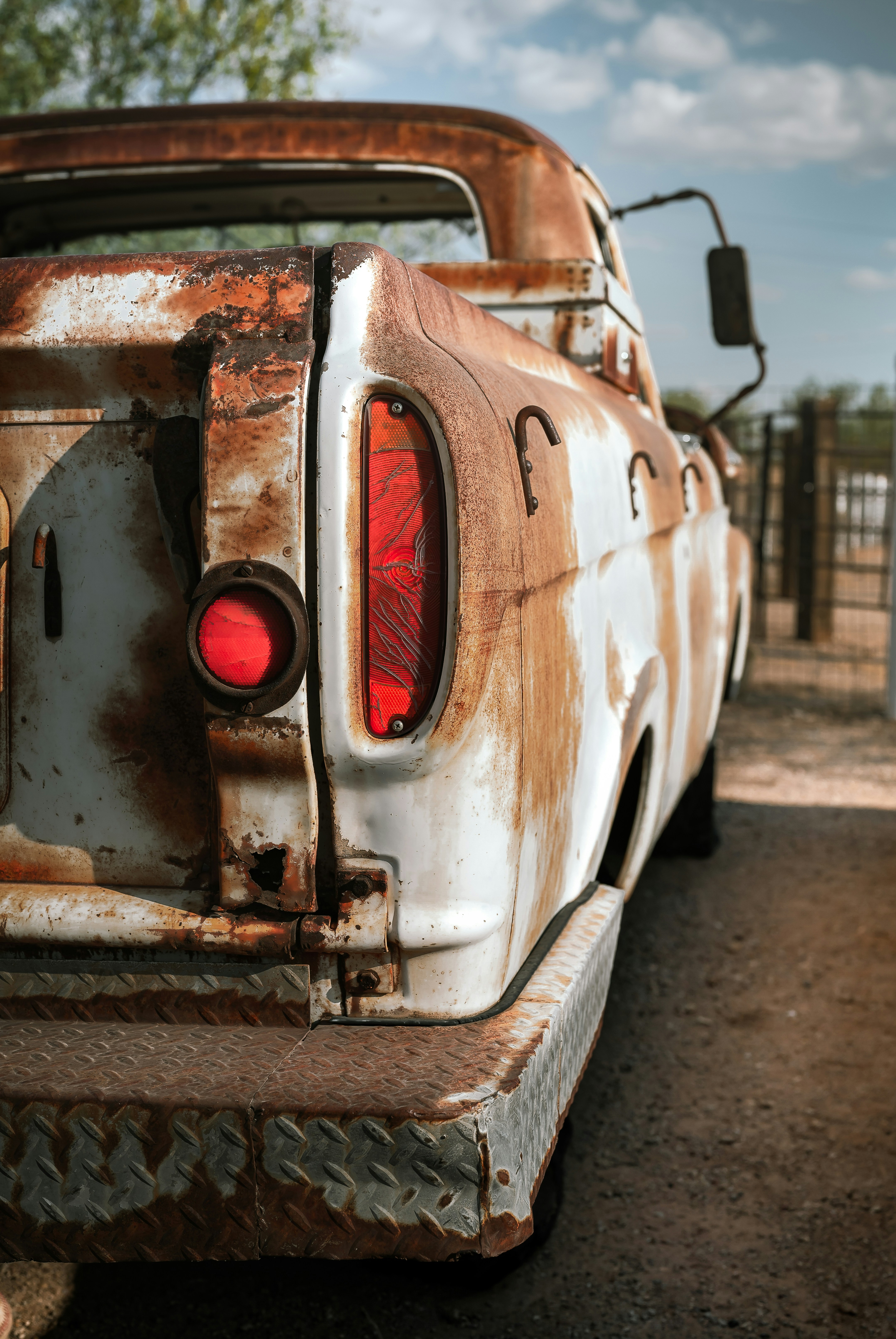A rusted out car with a red light on the back photo – Free Tucson Image ...