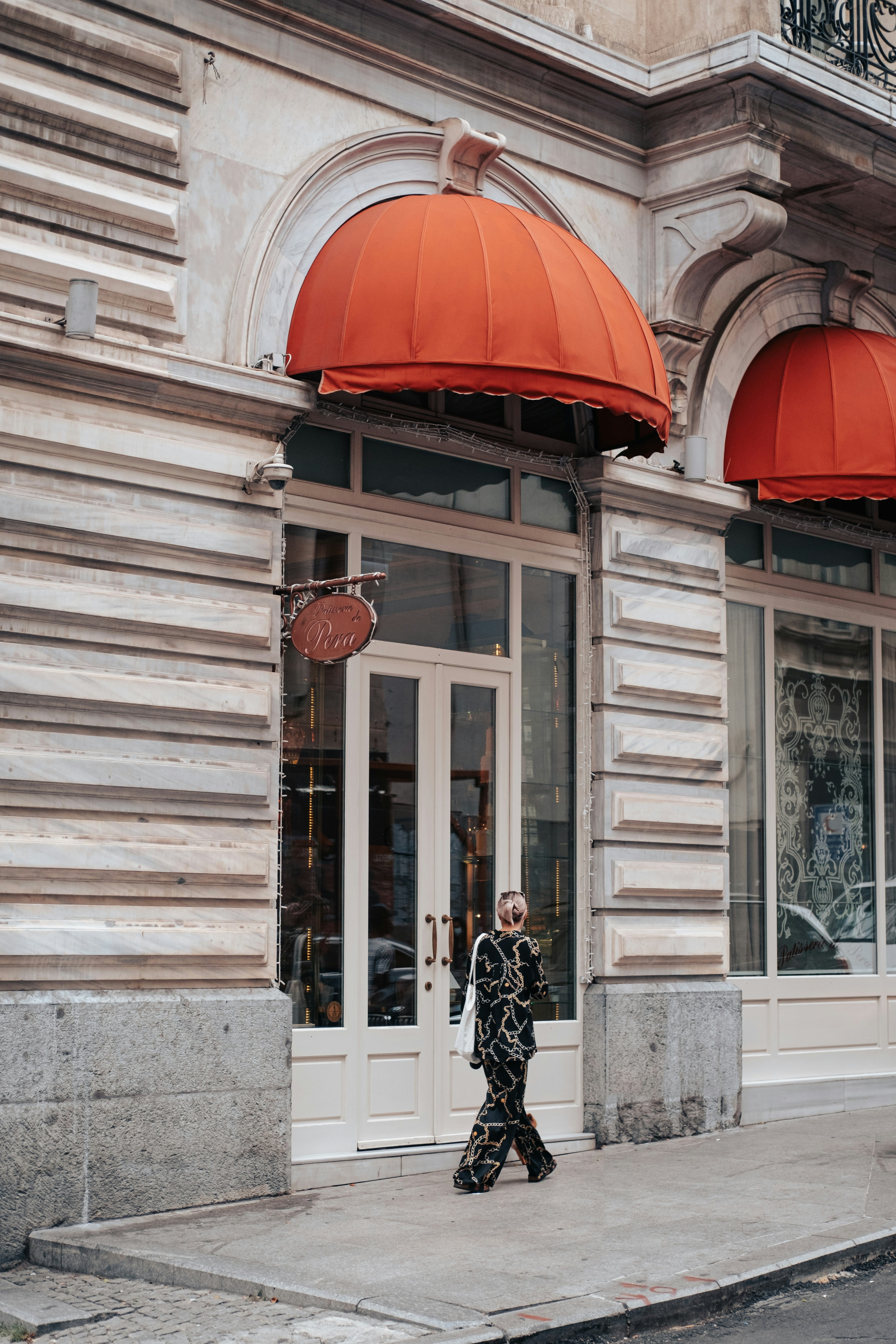 A person walking out of a building photo – Free Image on Unsplash