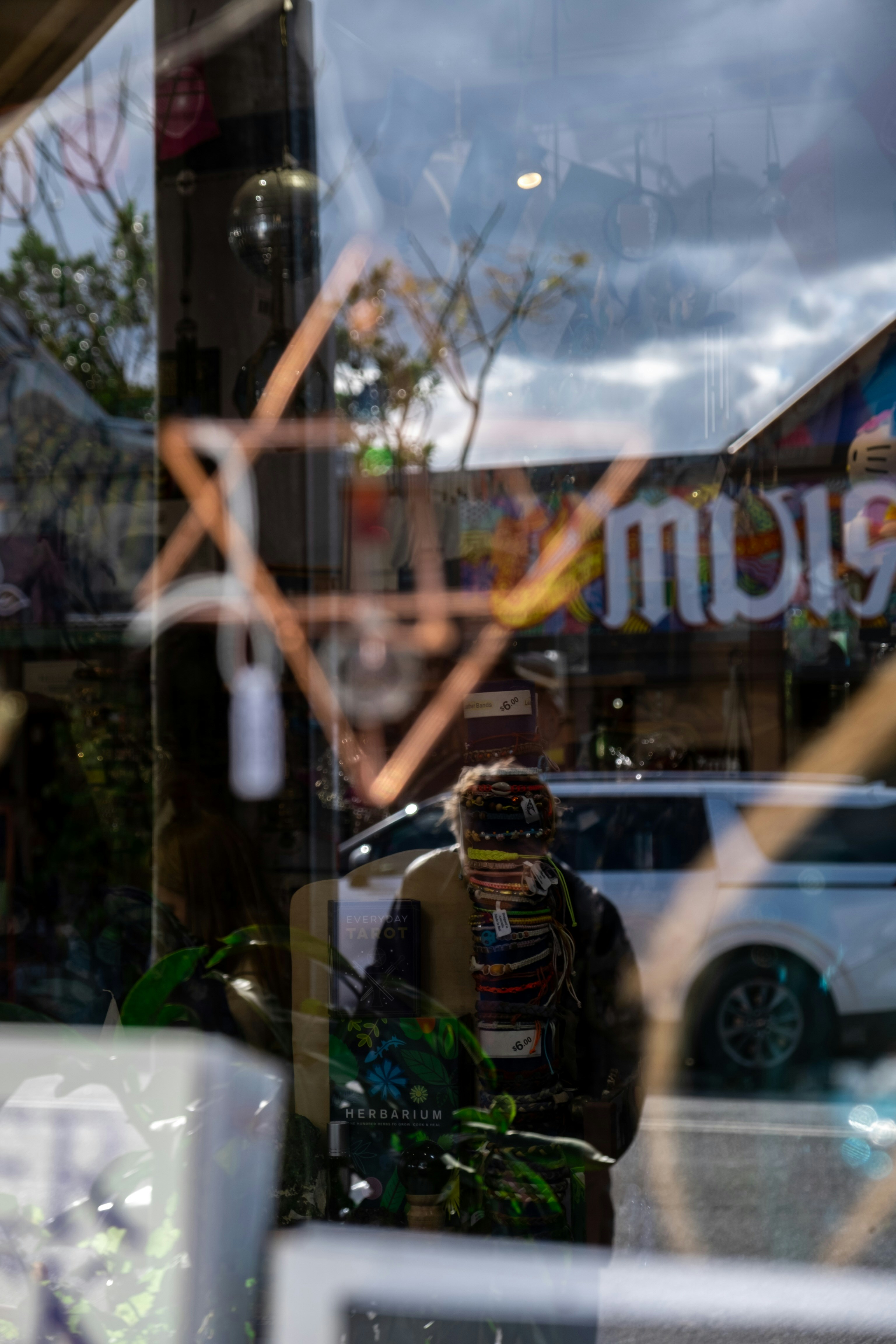 Windowpane Geometry: Reflections and a Street Portrait in Glass