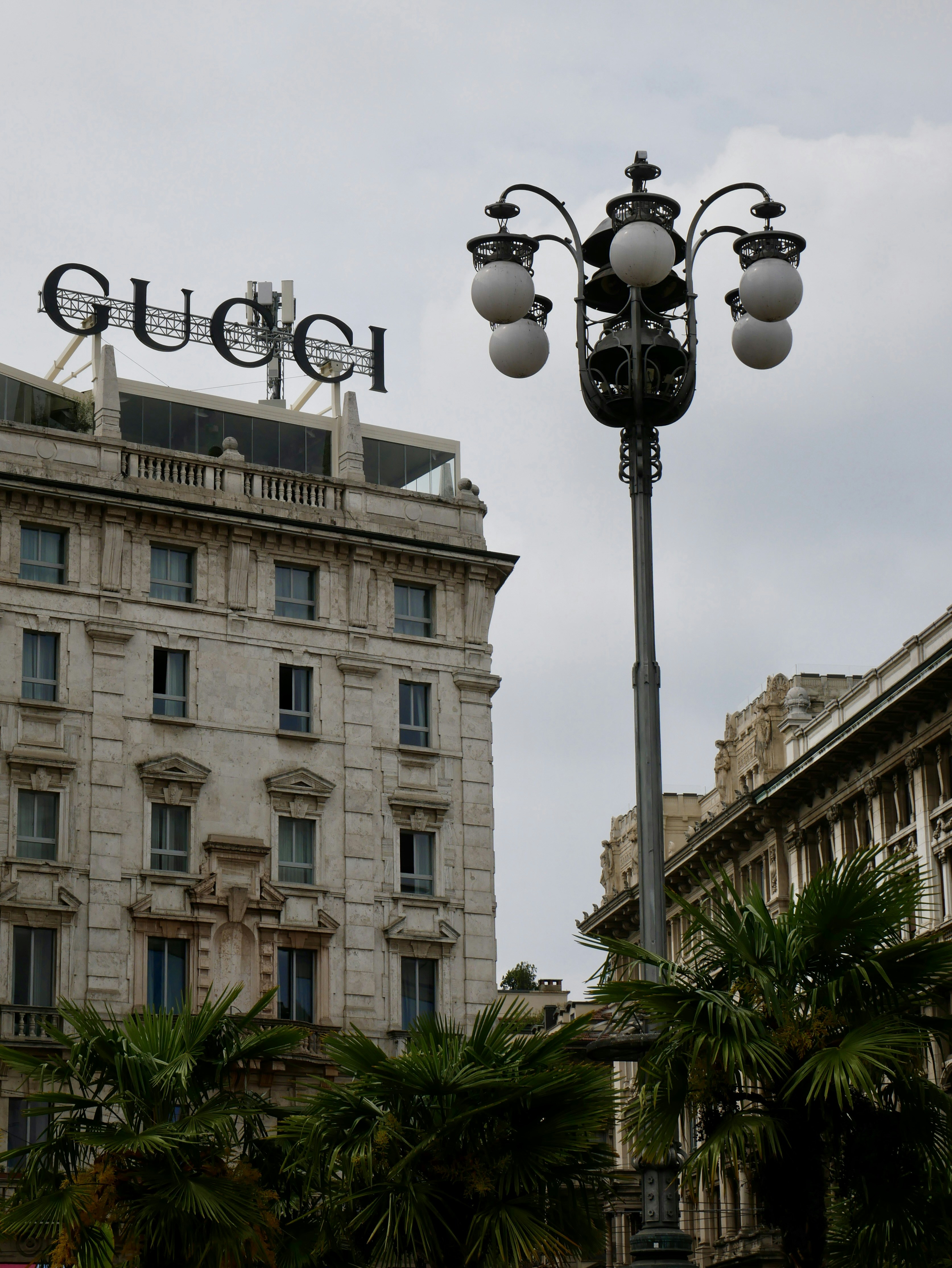 Gucci Corner Lantern: Historic Facade Framed by an Elaborate Streetlamp