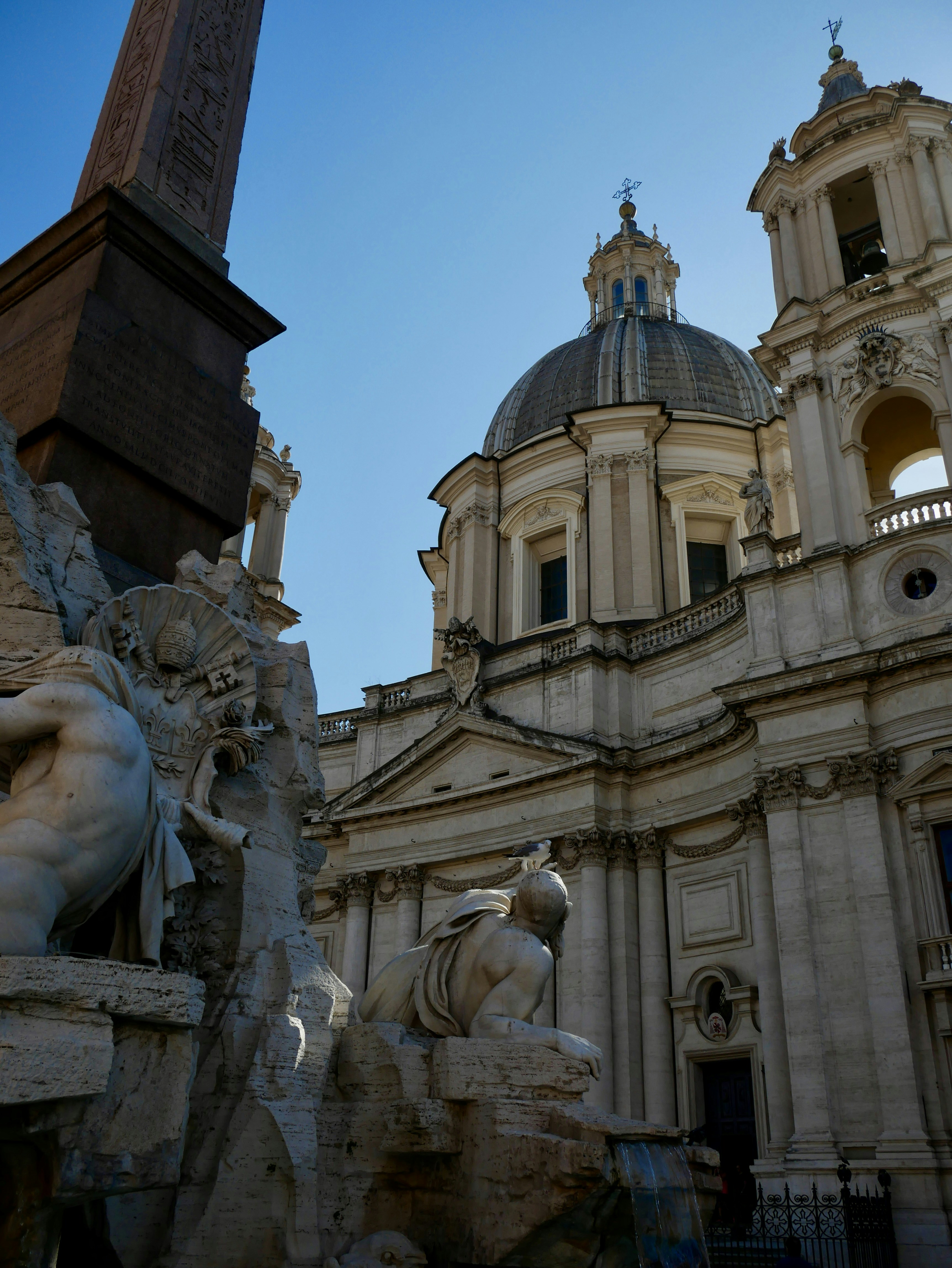 A stone building with a statue in front of it photo – Free Rome Image ...