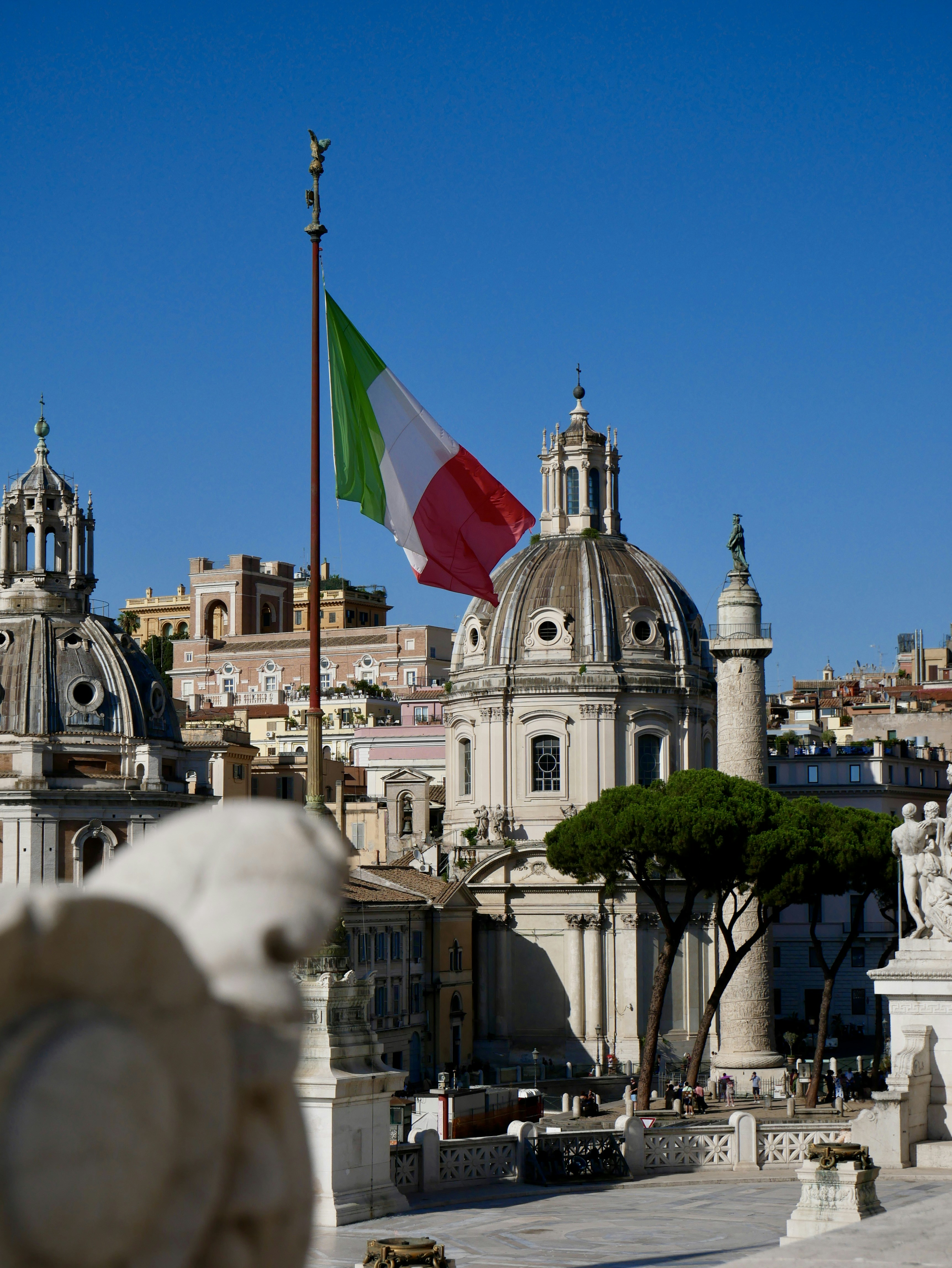 Flag Over Rome: A Quiet Window onto Baroque Domes and Sky