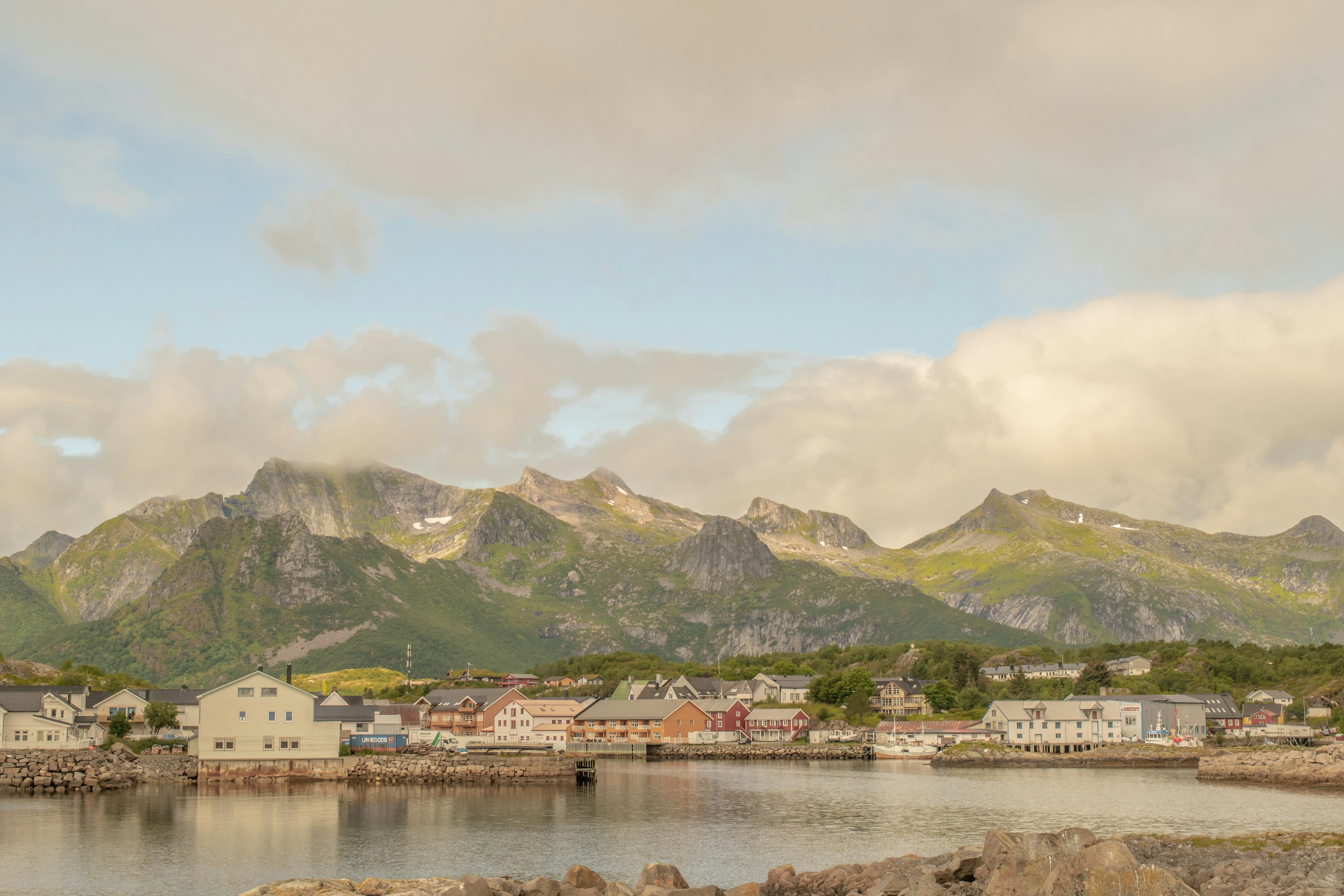 Quiet Harbor at the Foot of a Serrated Mountain Ridge