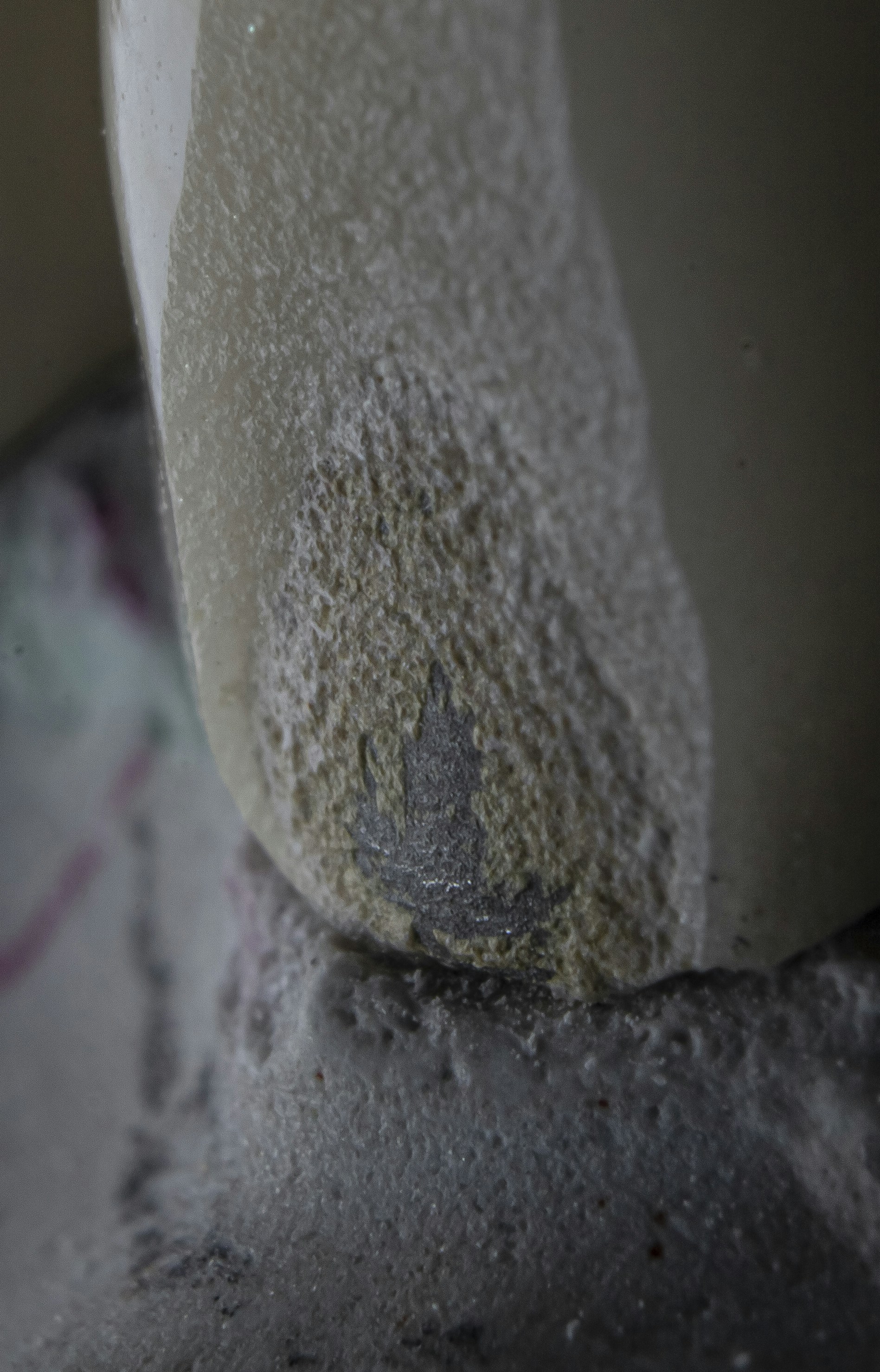 Granular Weathering: A Macro Portrait of a Dust-Covered Stone Pedestal