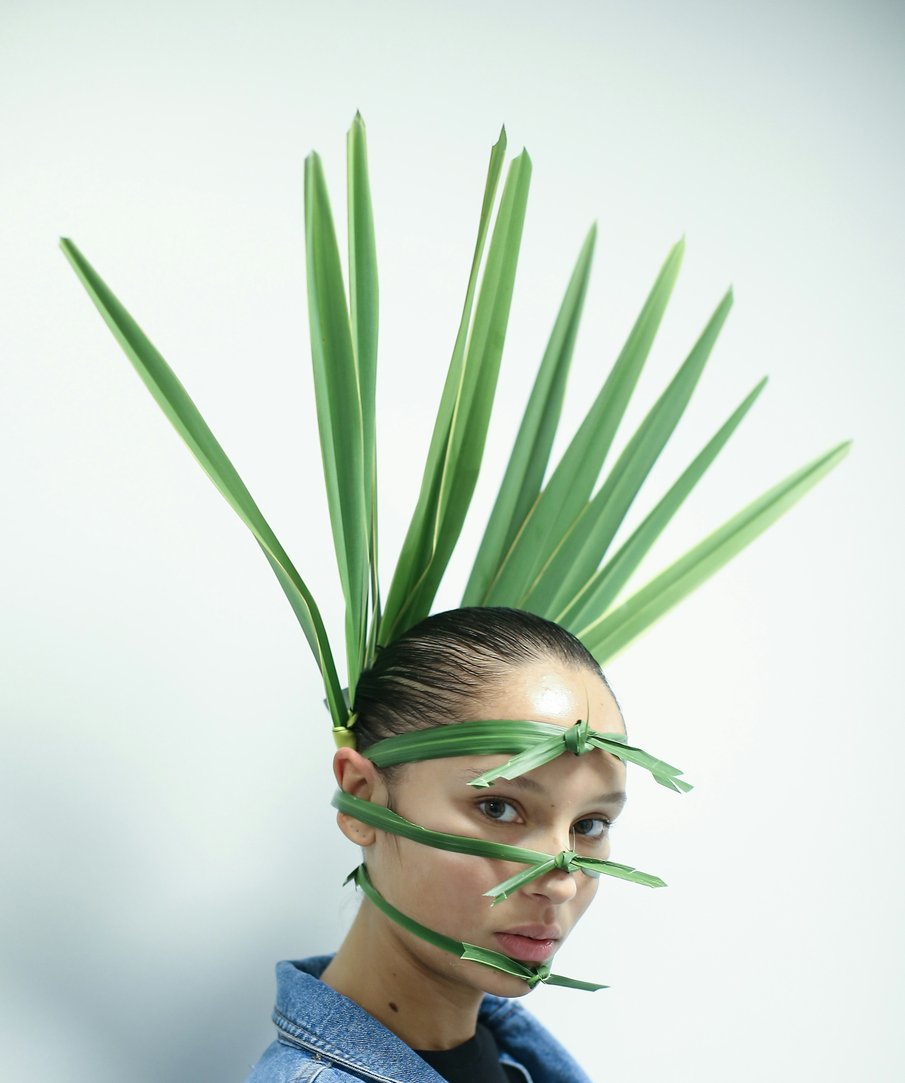 Palm Frond Crown Portrait: Fronds Framing a Quiet, Fashion-Forward Gaze