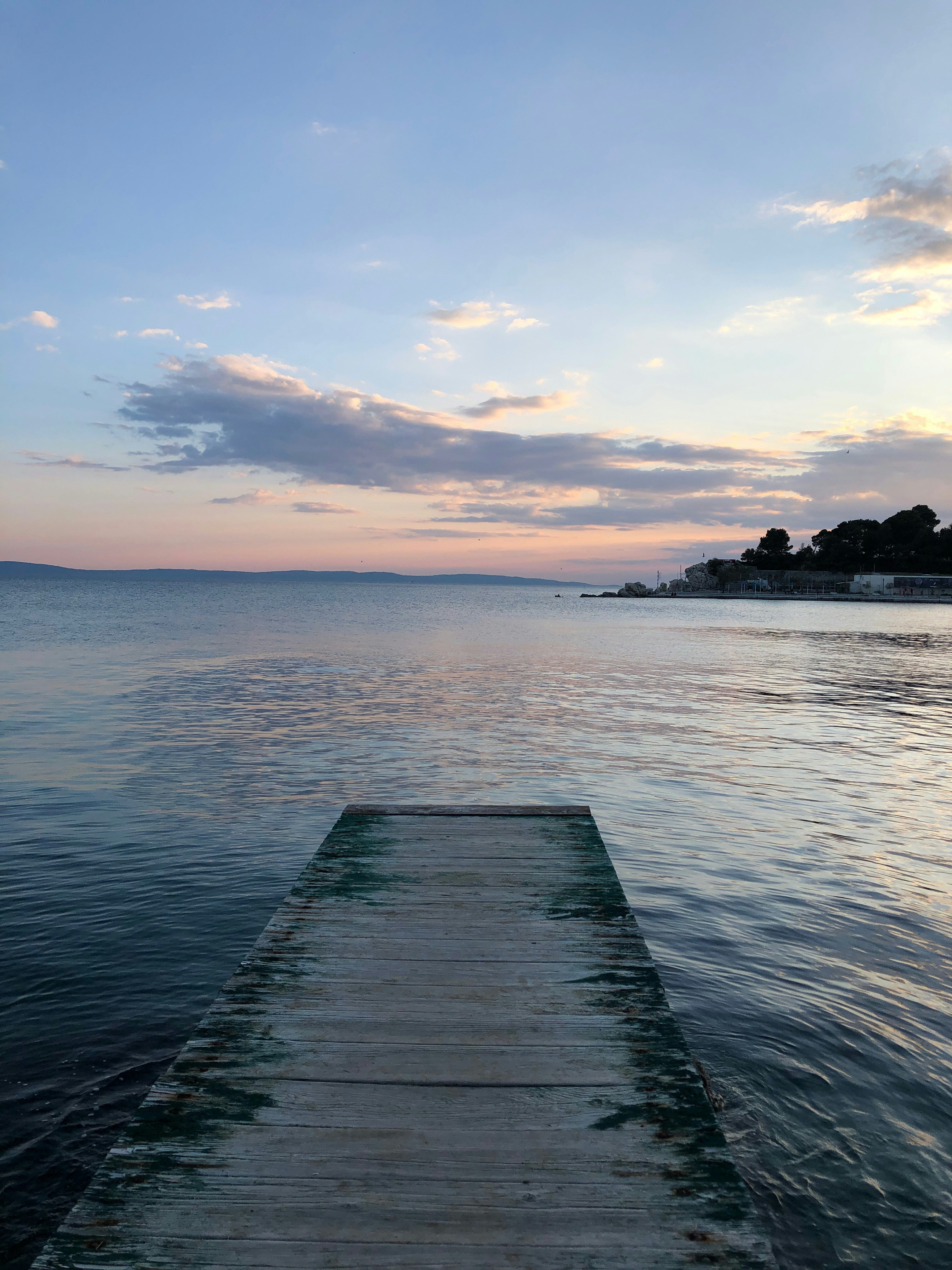 Pastel Pier: Dusk's Quiet Confluence of Water and Wood