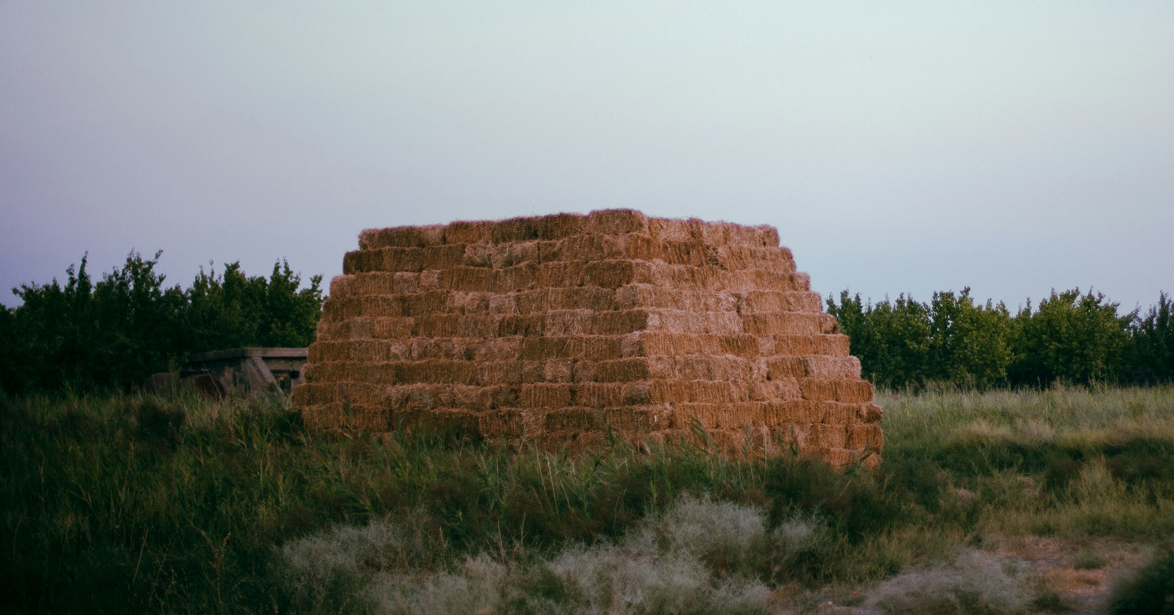 Sun-baked Brick Rampart Amid a Calm Prairie at Dusk