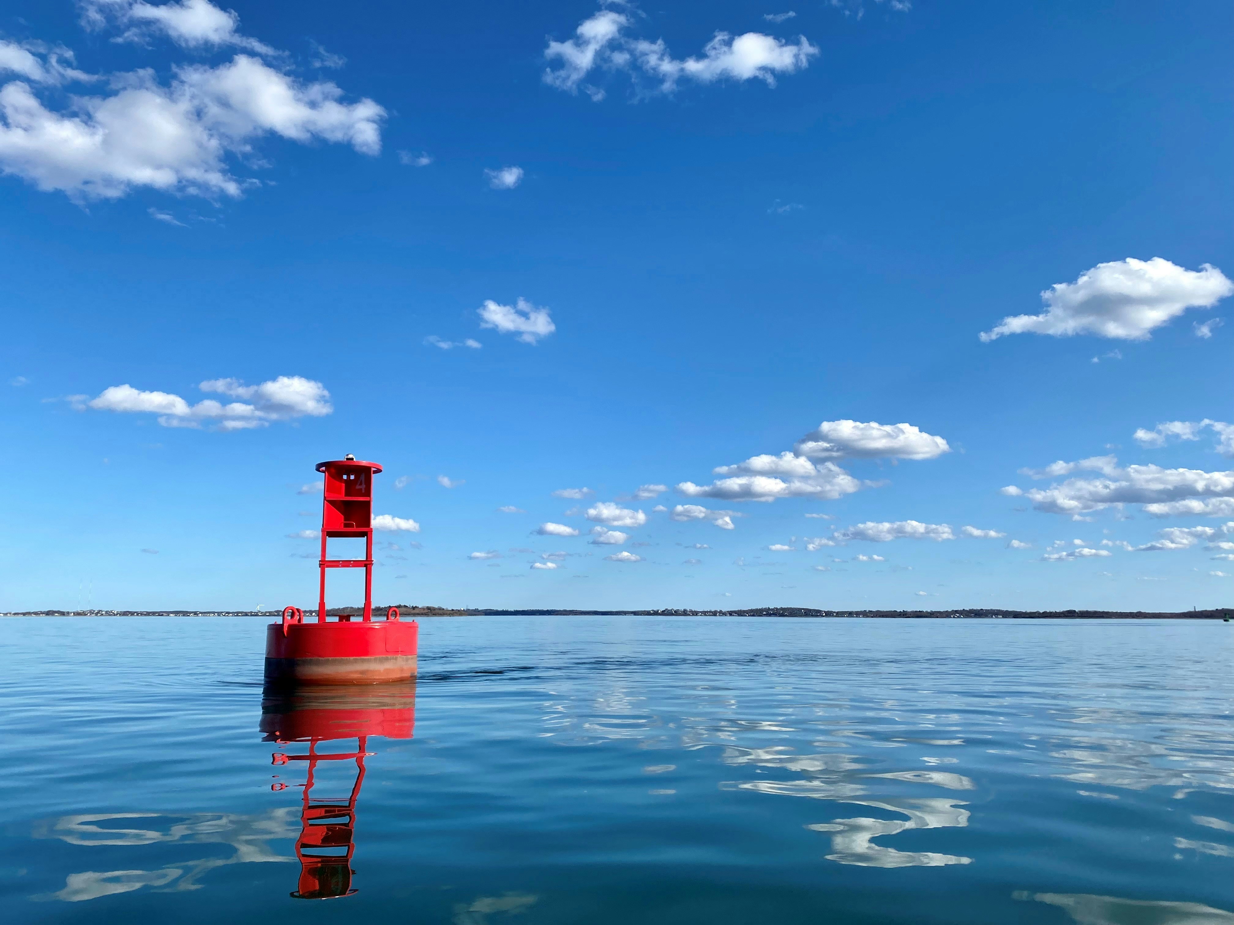 A red tower in the middle of a body of water photo – Free Peddocks ...
