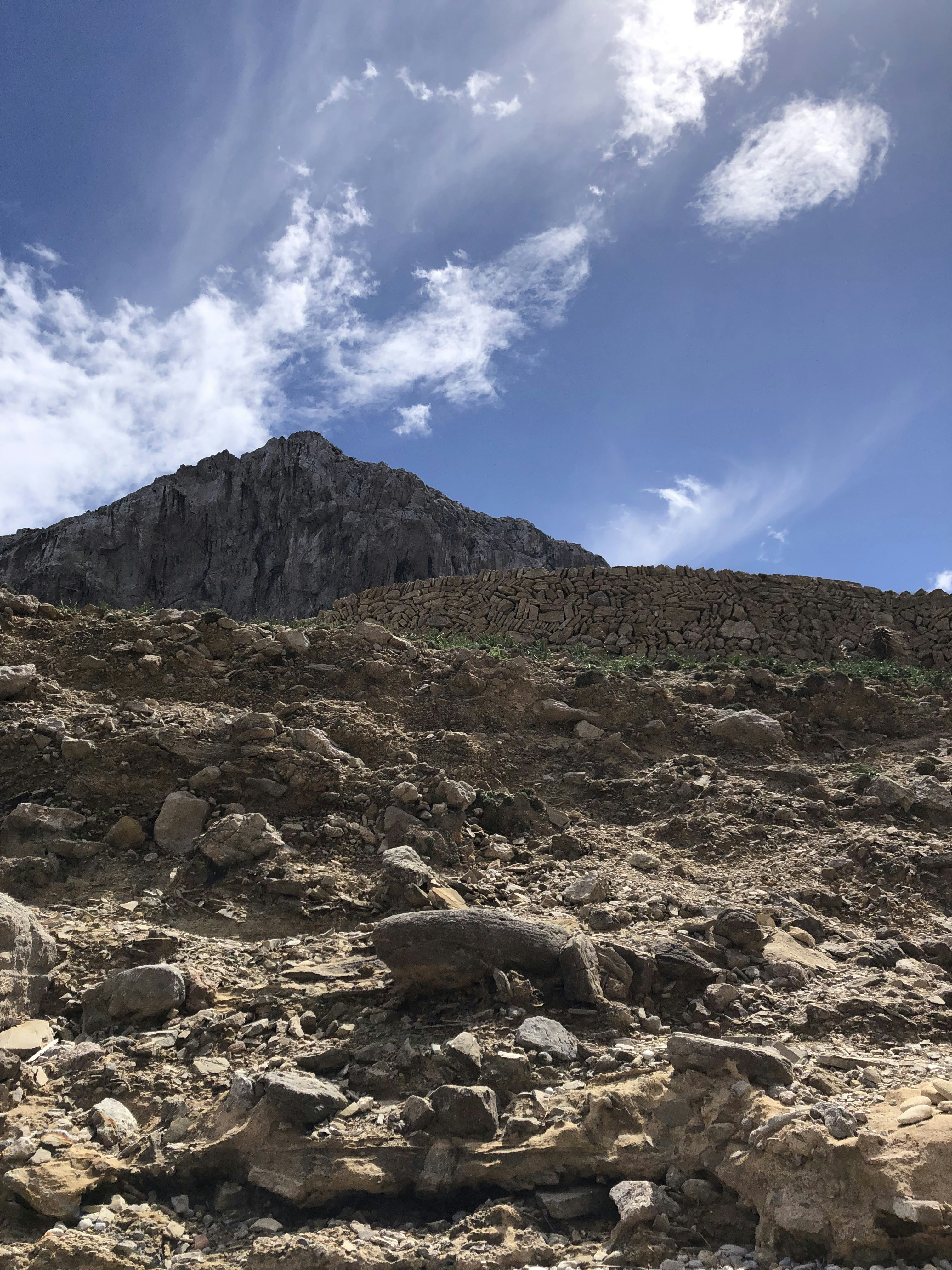Rugged ascent beneath a Laconic Peak
